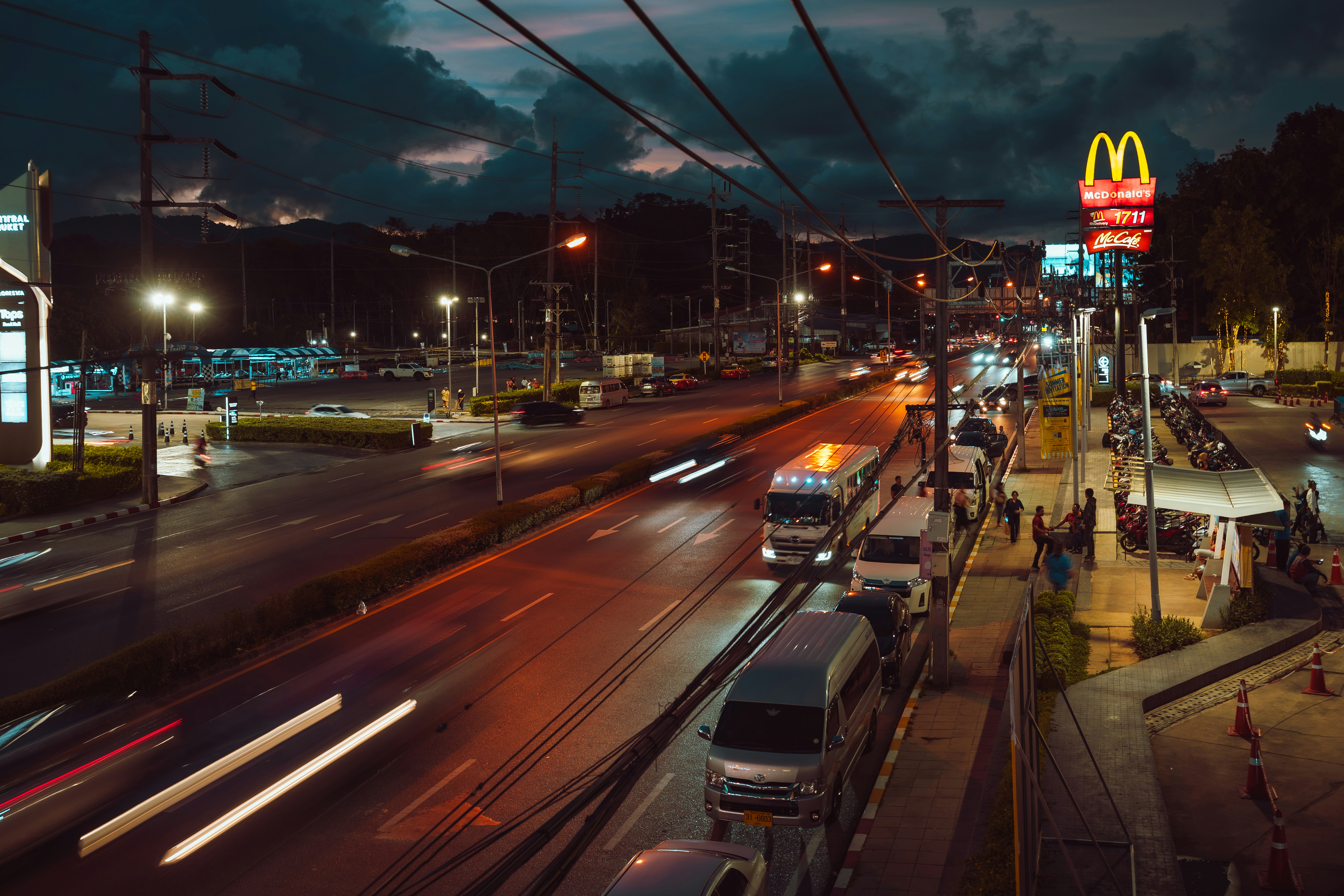 Neon Rush at Sunset Drive: A Busy Urban Night