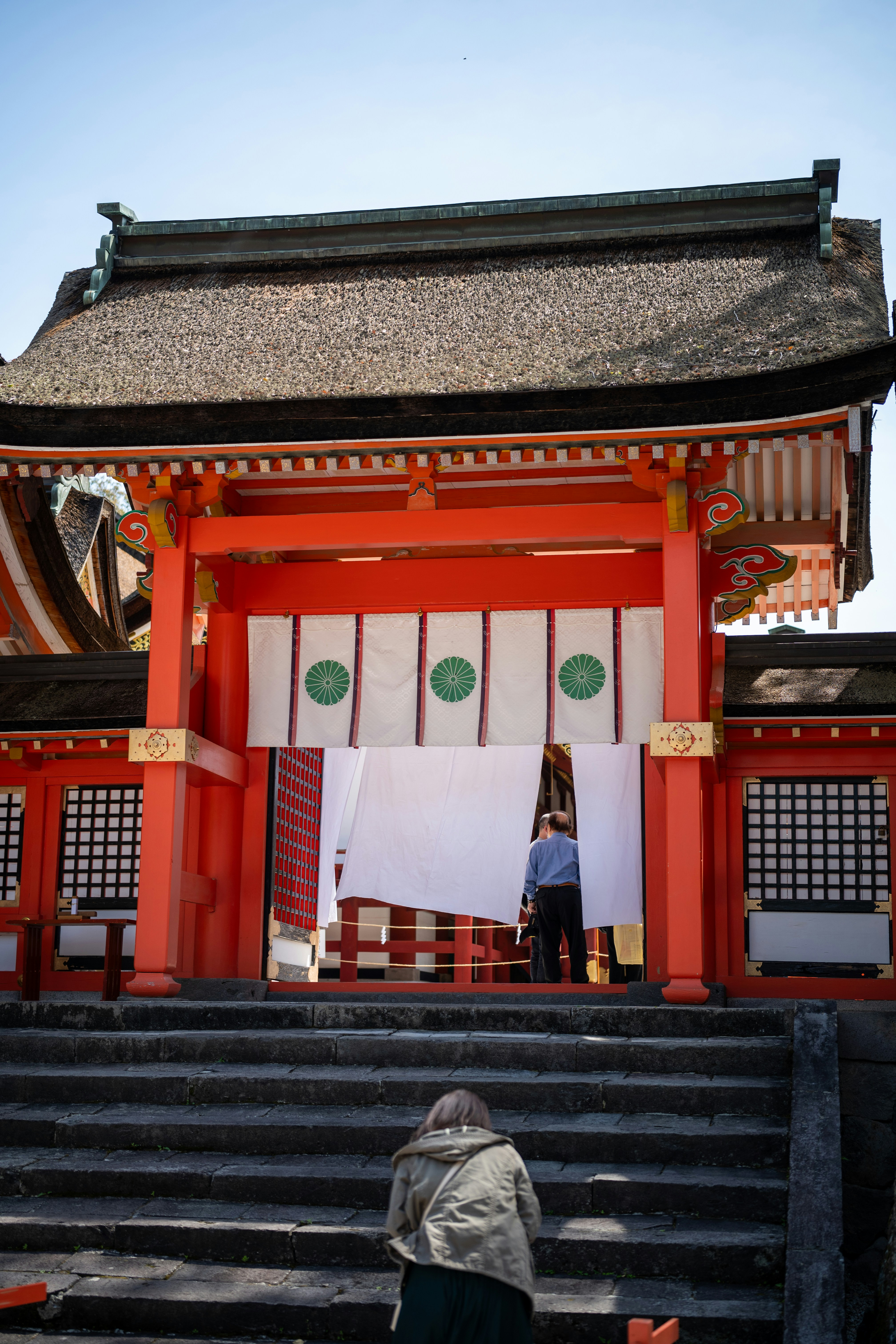 People visit and pray at a vibrant japanese shrine. photo – Free Image ...