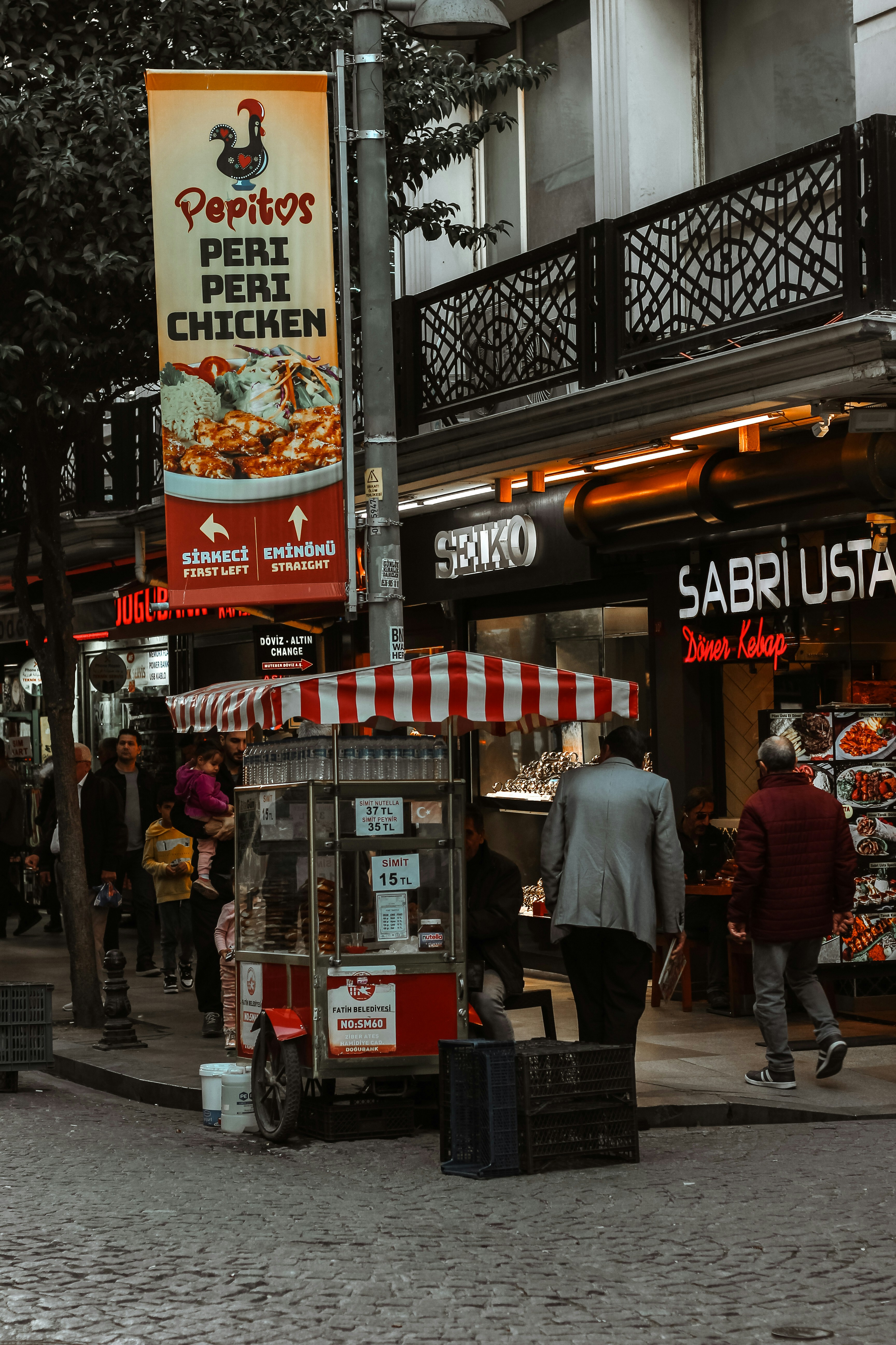 Striped Street Cart at a Cobblestone Corner