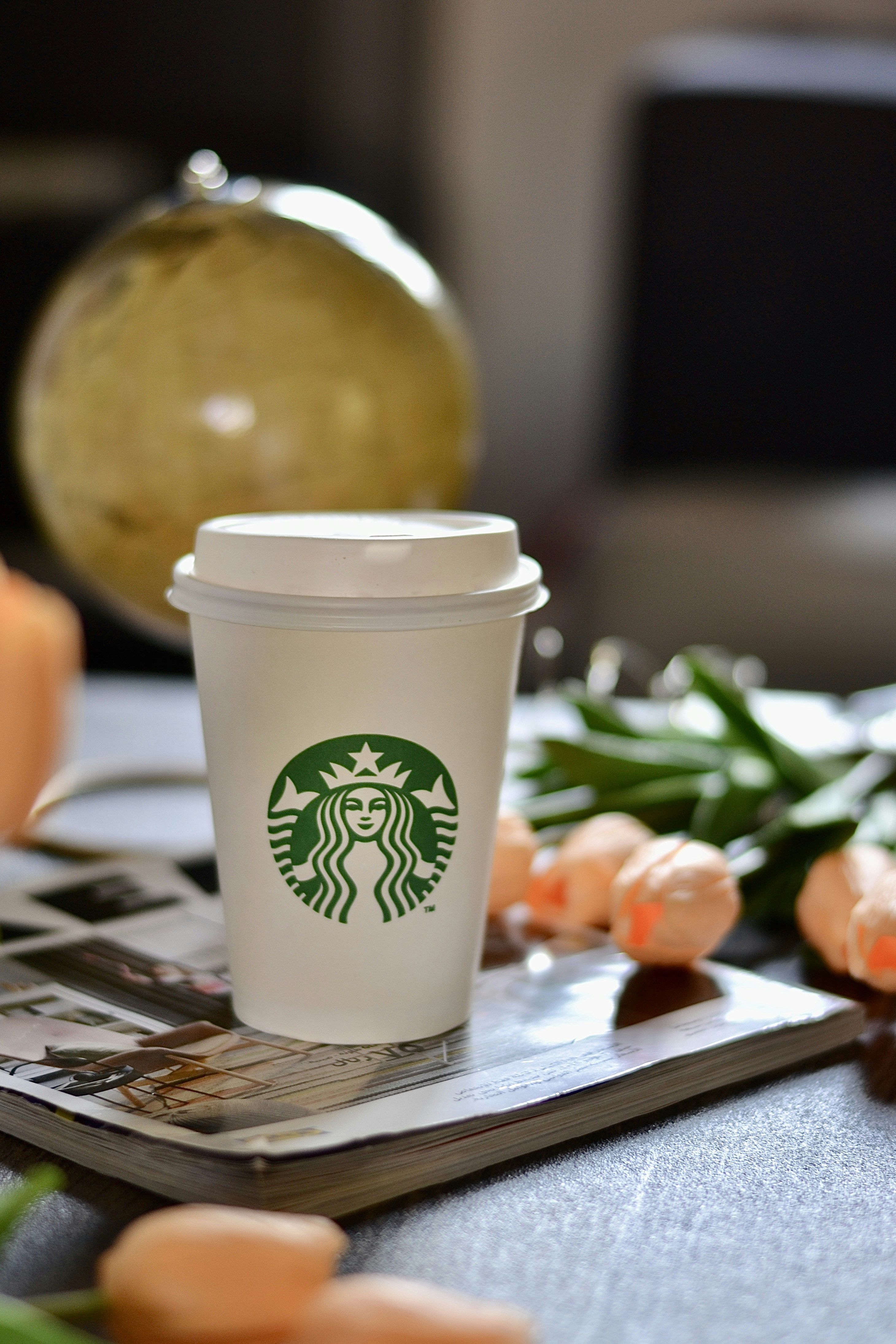 Starbucks coffee cup rests on a magazine. photo – Free Home background ...