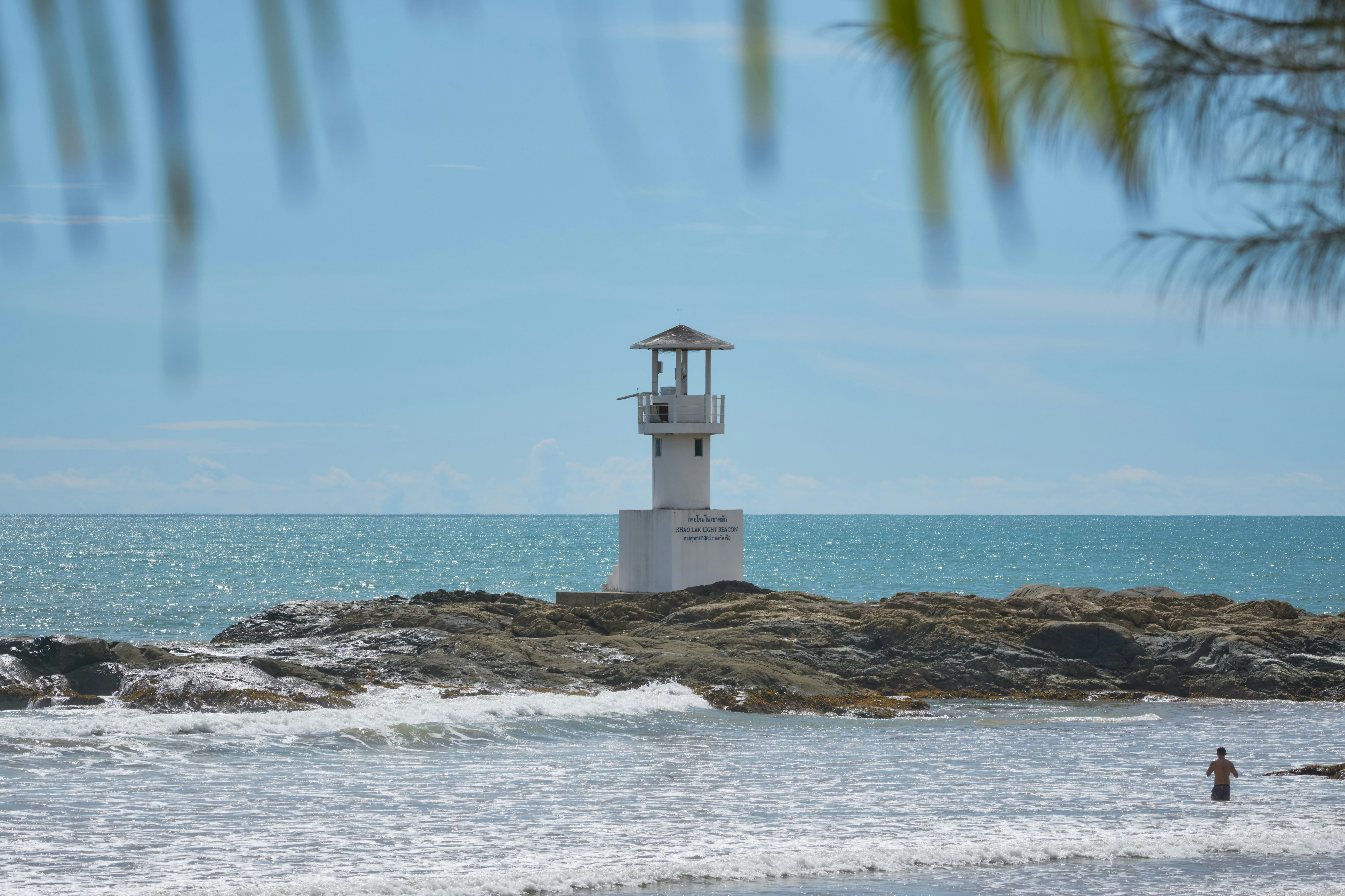 Lighthouse on a Quiet Reef: A Panoramic Seascape