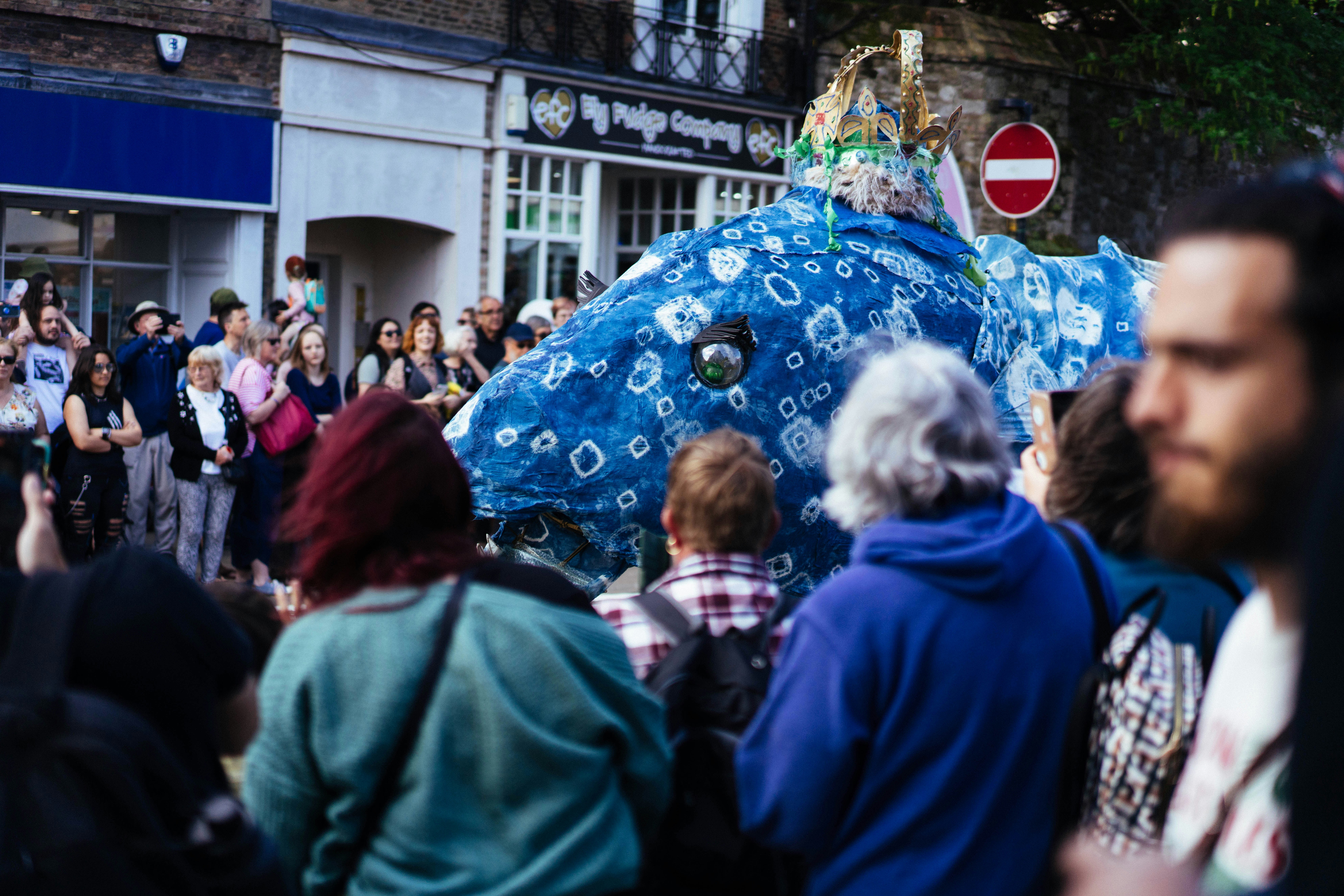 Cerulean Dragon Parade: Crowds Encircle a Regal Street Beast