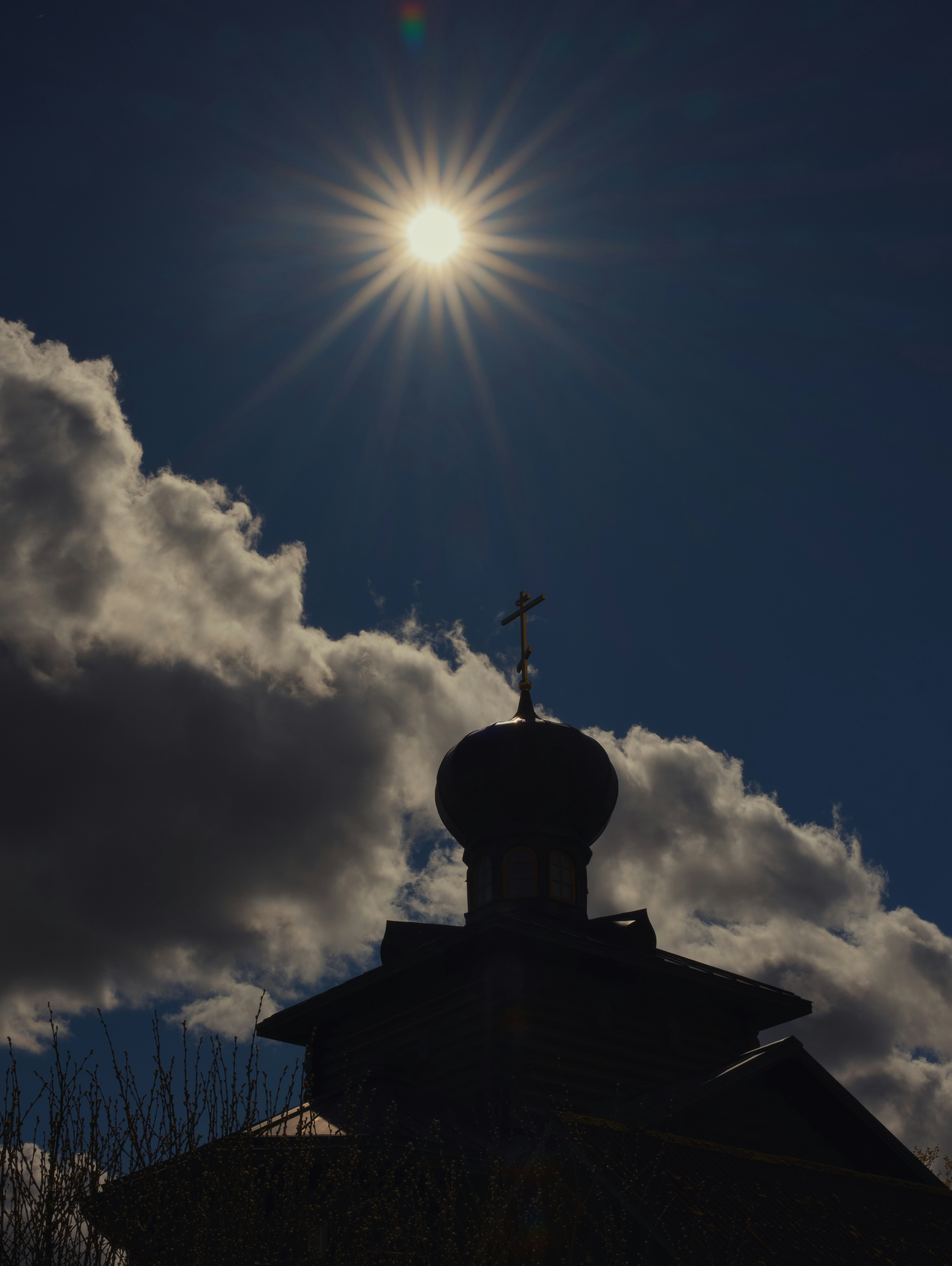 Sunburst Above the Silhouette: A Turbanned Church Dome at Noon