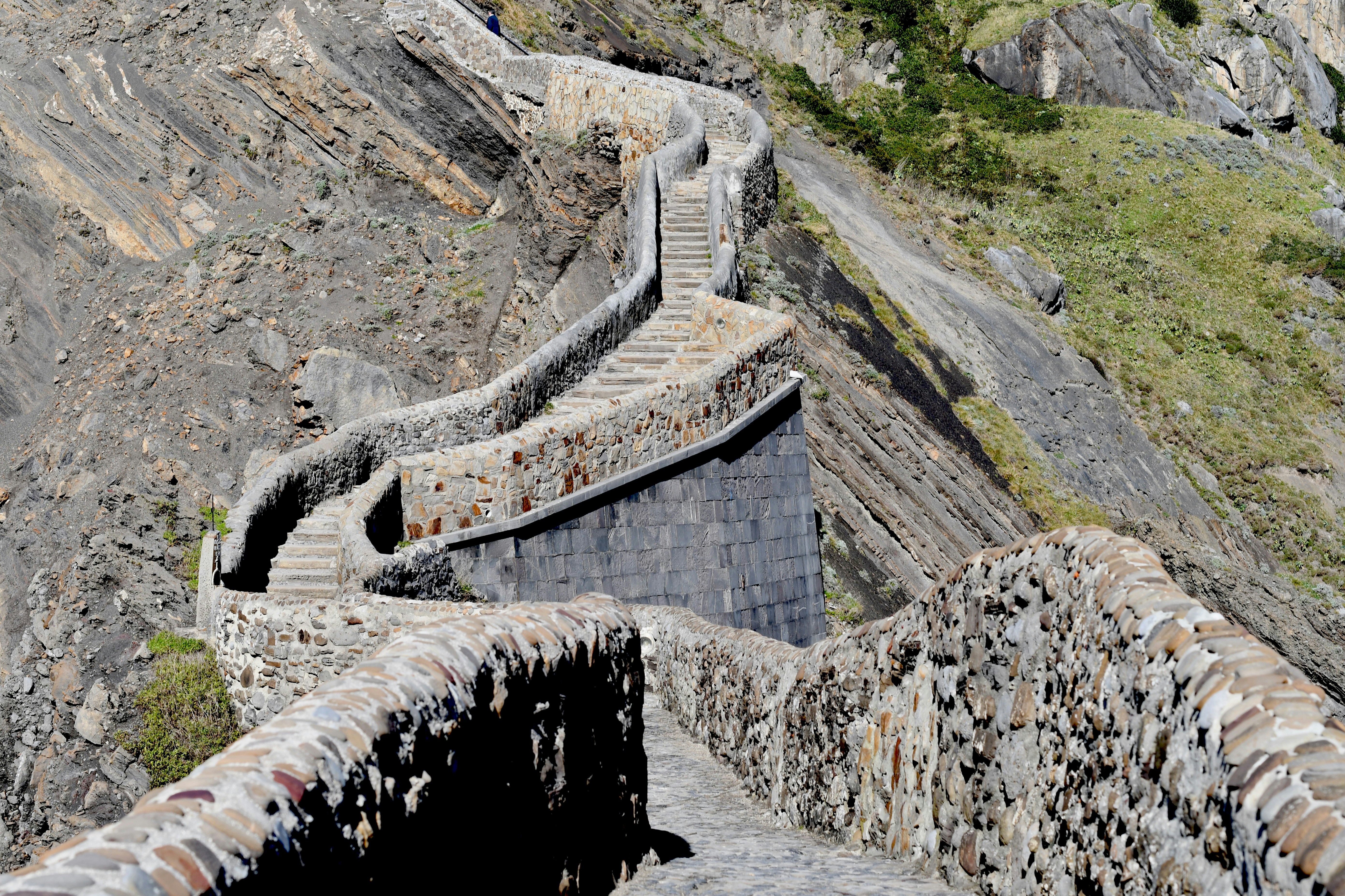 A winding stone pathway climbs a rocky hillside. photo – Free ...