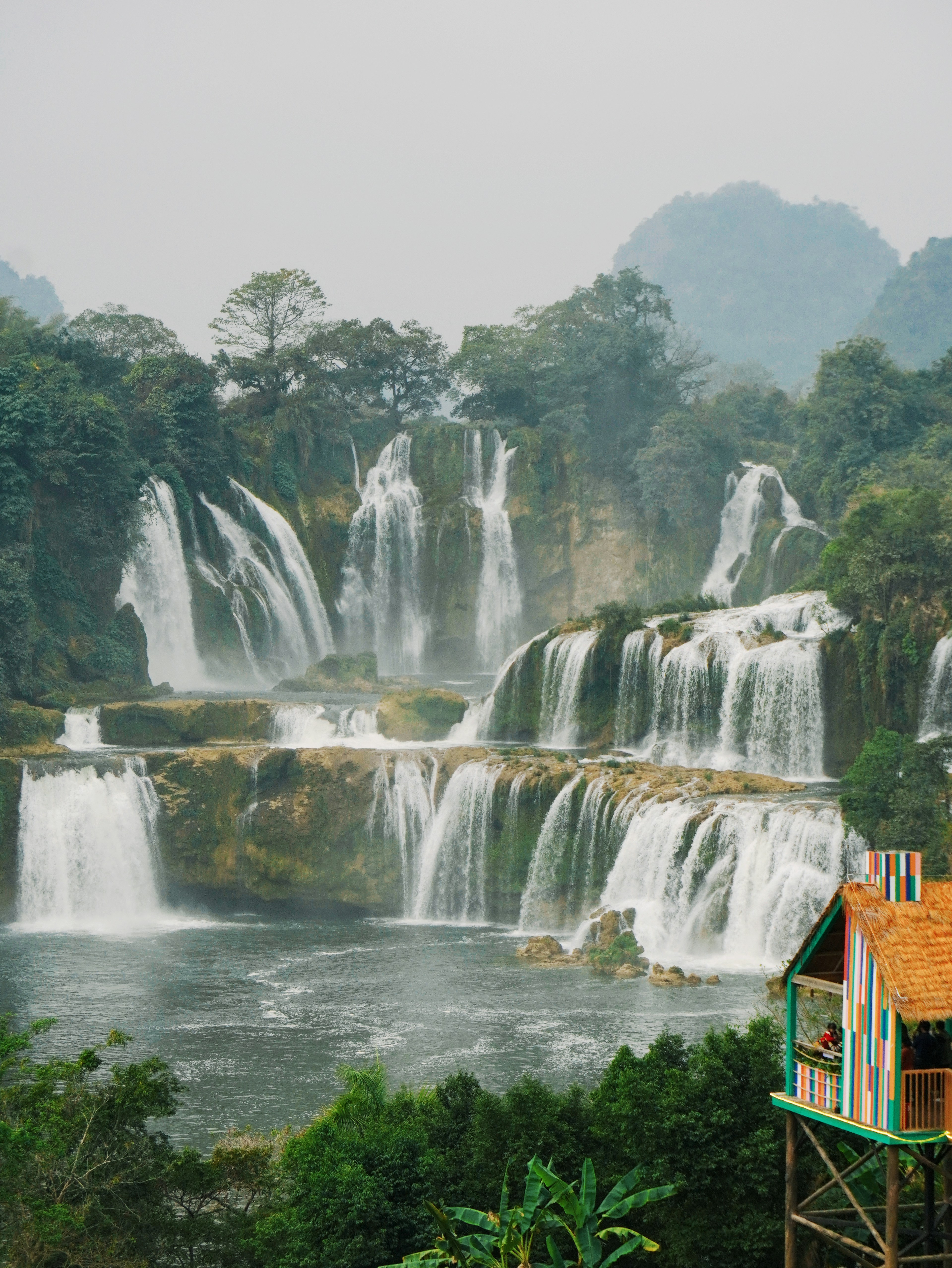 A majestic waterfall cascades into a lake. photo – Free Travel Image on ...