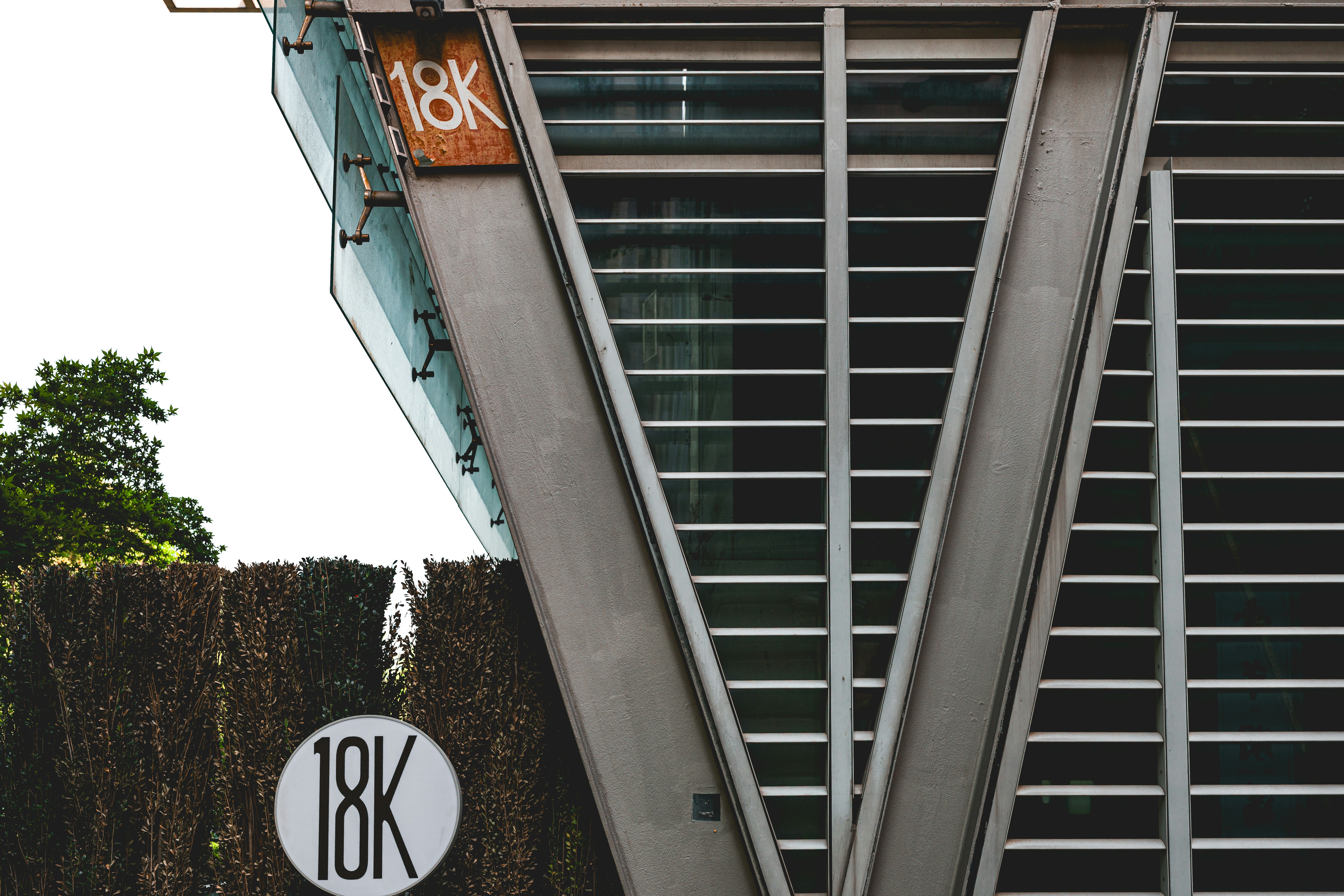 Architectural Angles: Concrete Struts Framing the 18K Sign