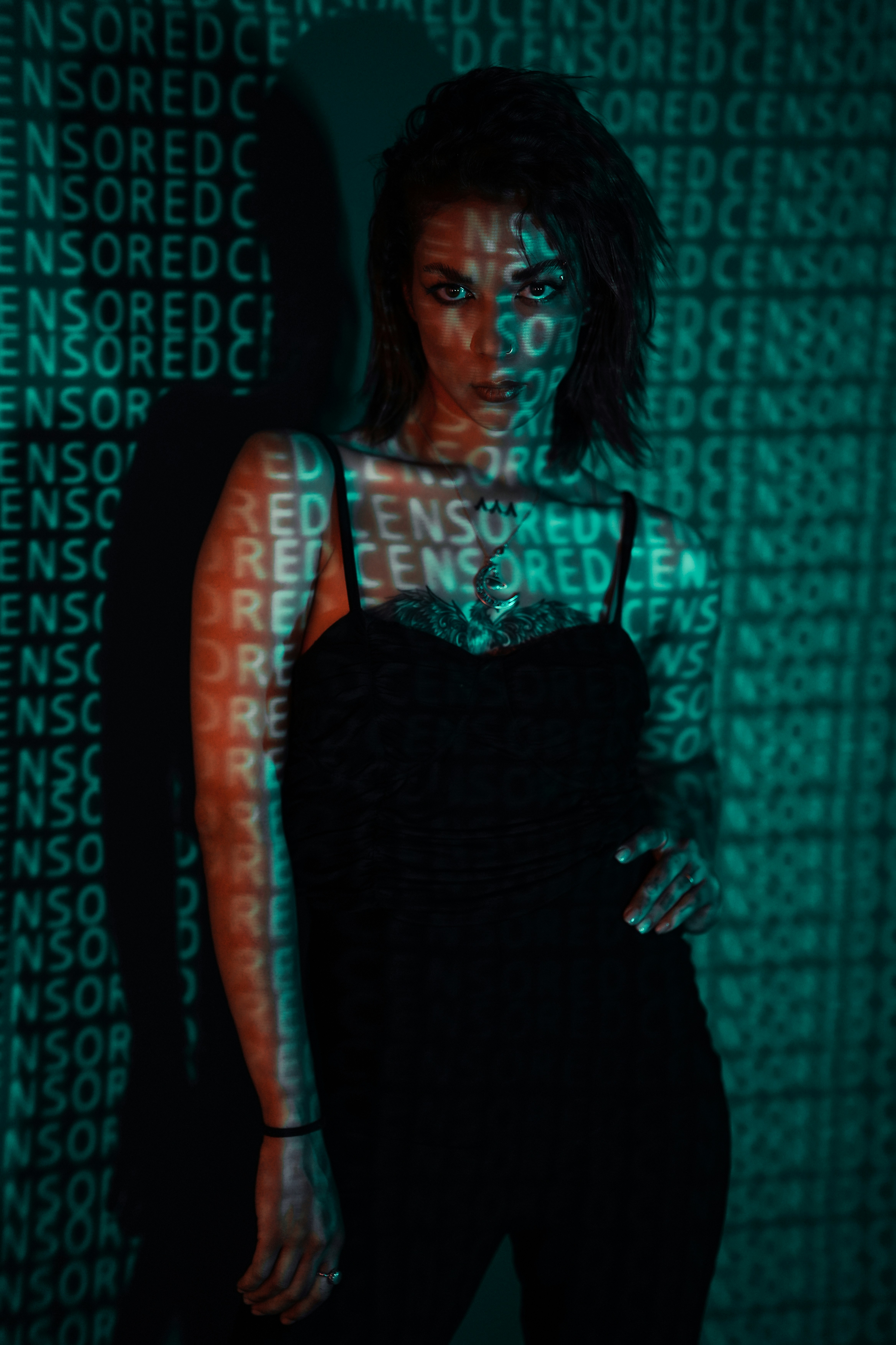 Woman poses under a shadow of the word "censored." photo – Free Woman ...