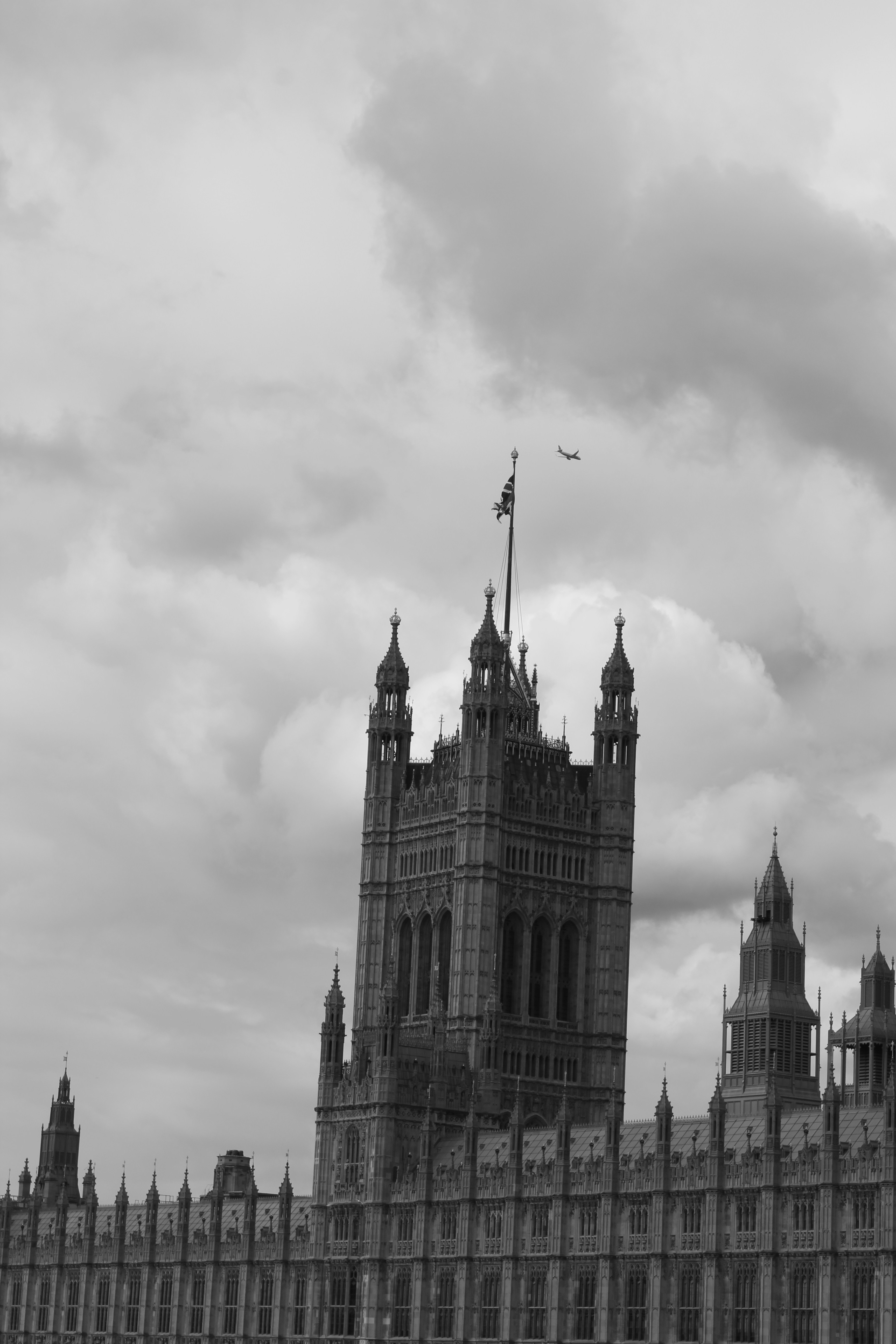 Gothic Tower Amid Cloudscape: Westminster in Monochrome