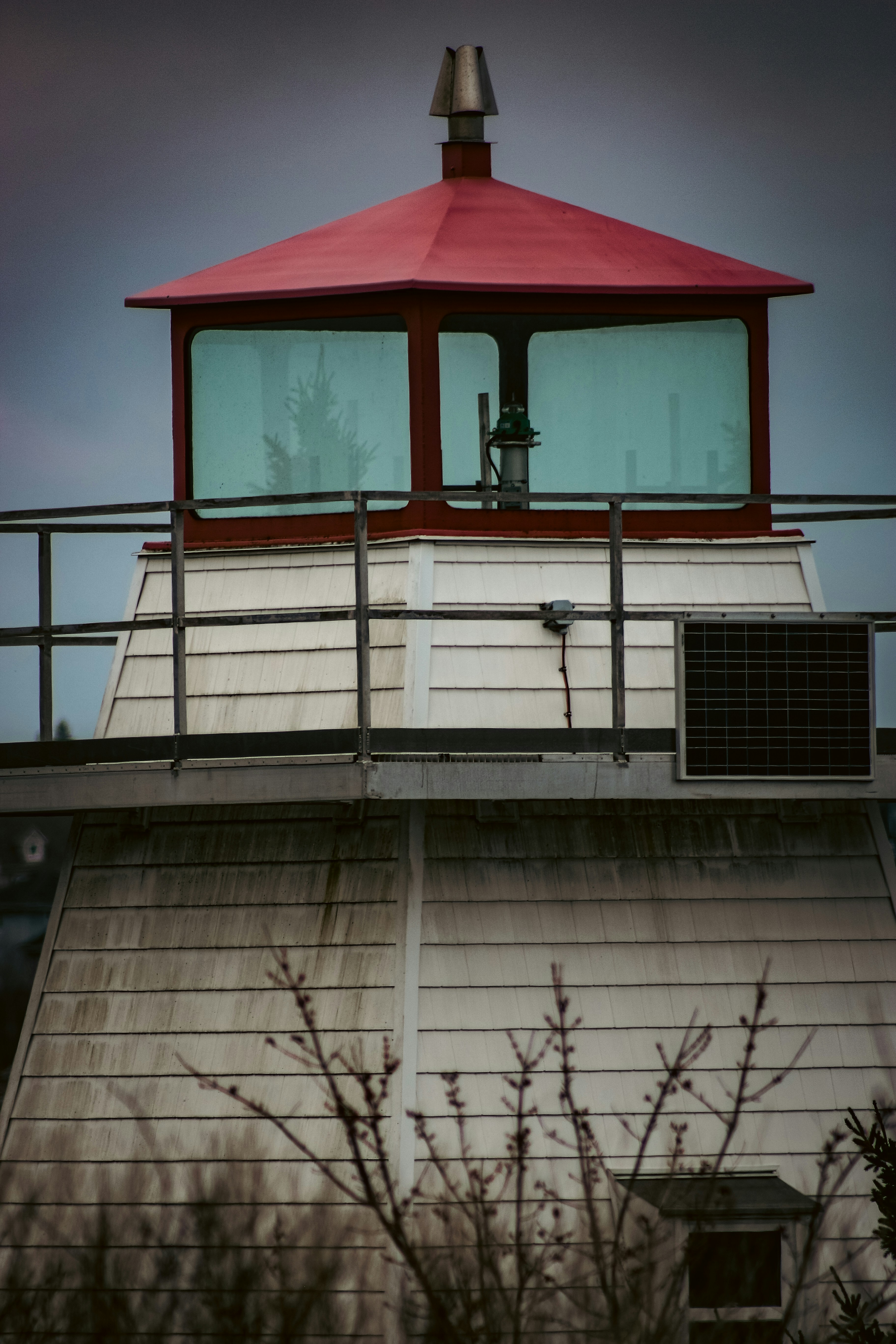 Crimson Cupola Framed Above a Weathered Rooftop