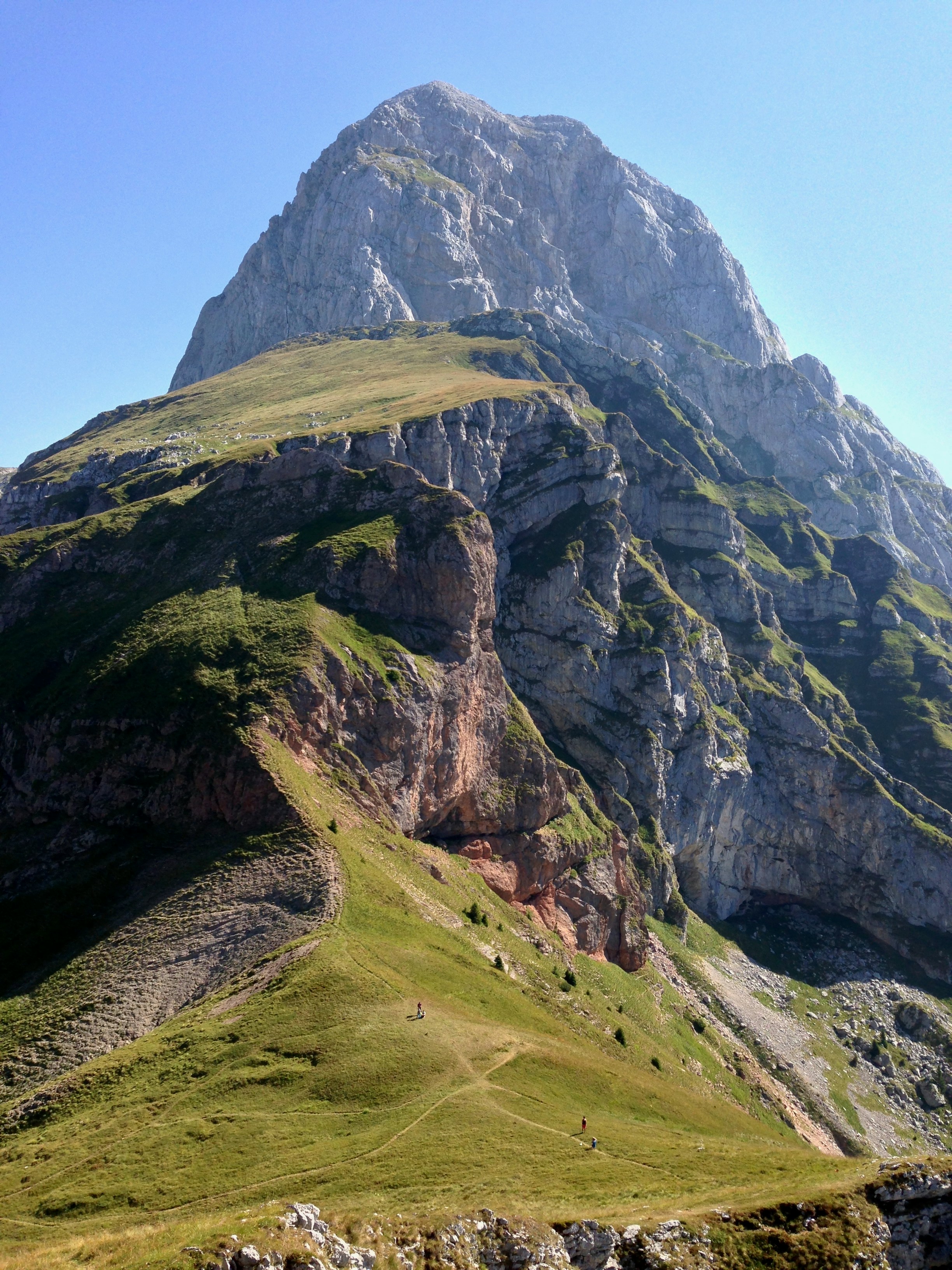 Alpine Crown: Granite Summit Against a Clear Blue Canopy