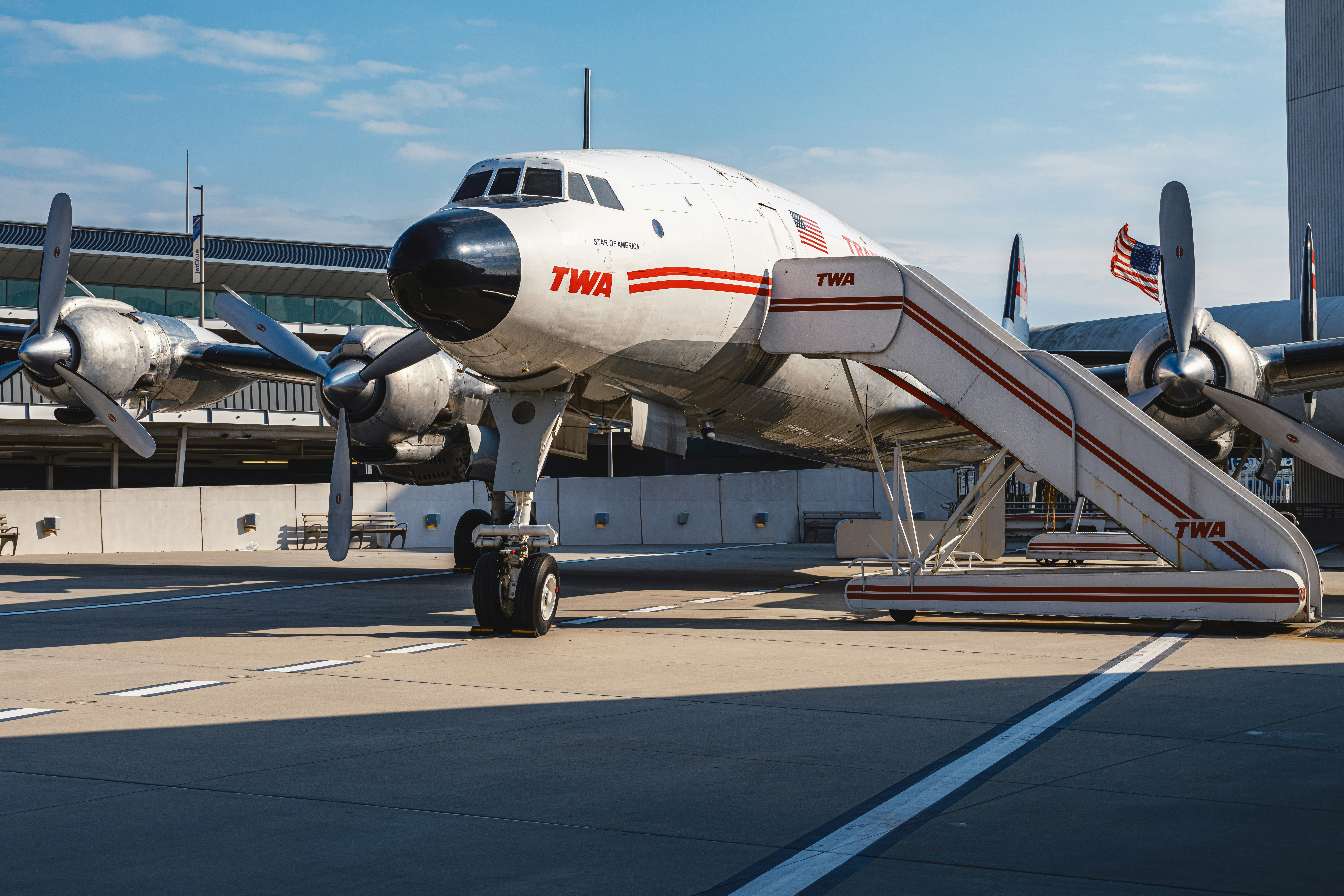 TWA Classic on the Ramp: Four-Engine Nostalgia by the Staircase
