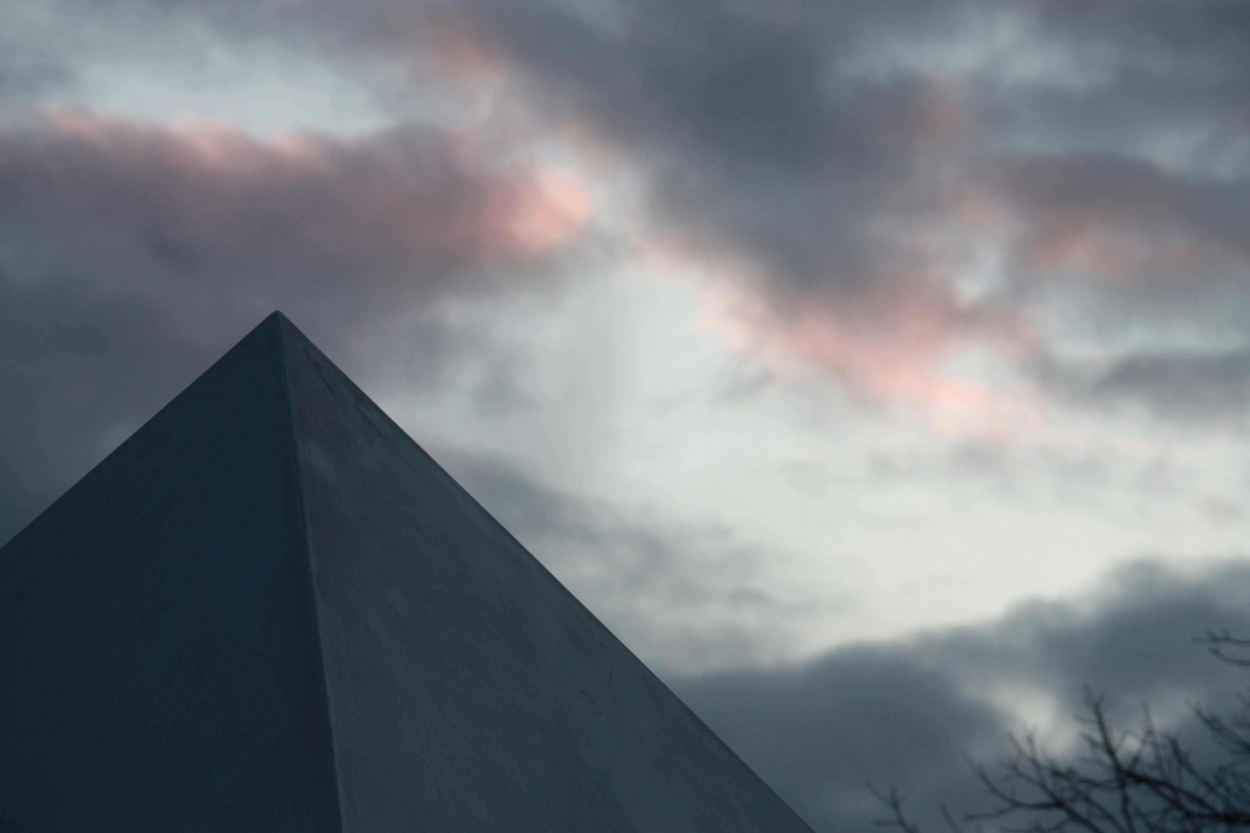 Pyramid pointing towards the cloudy sunset sky. photo – Free Pyramid ...