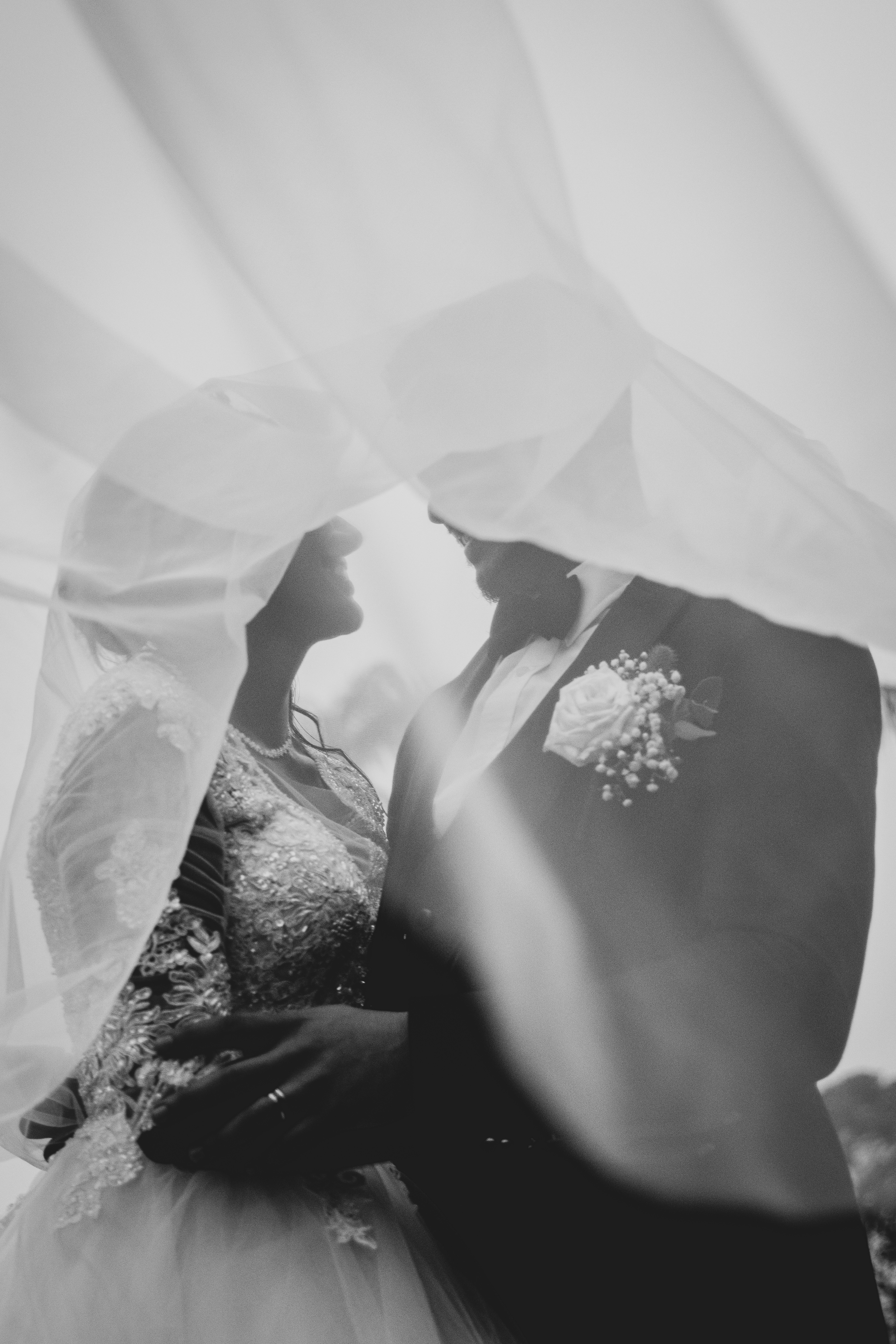 A bride and groom share a tender moment. photo – Free Portrait Image on ...