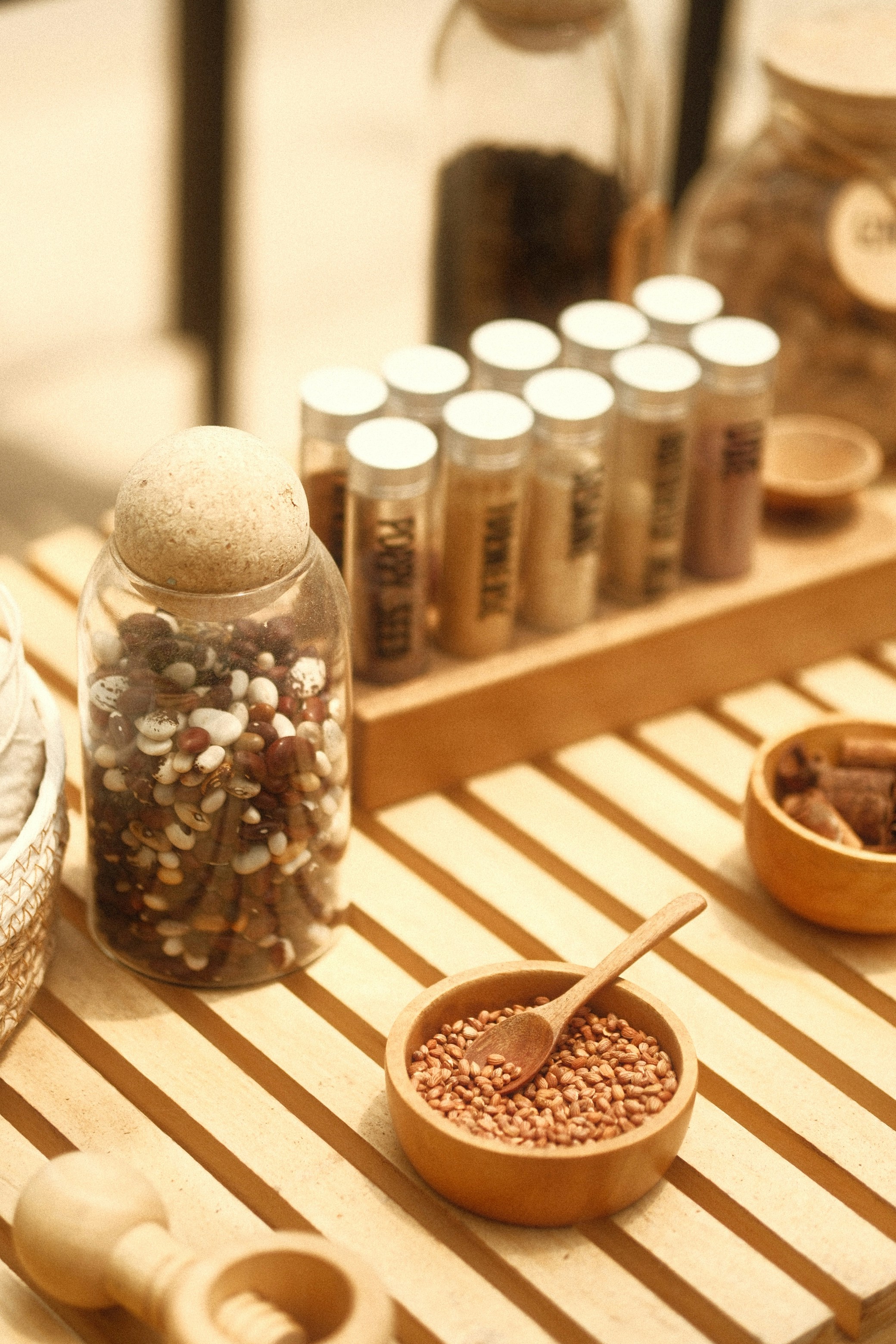 Amber Glow on Wooden Still Life: Seed Bowl and Glass Jar
