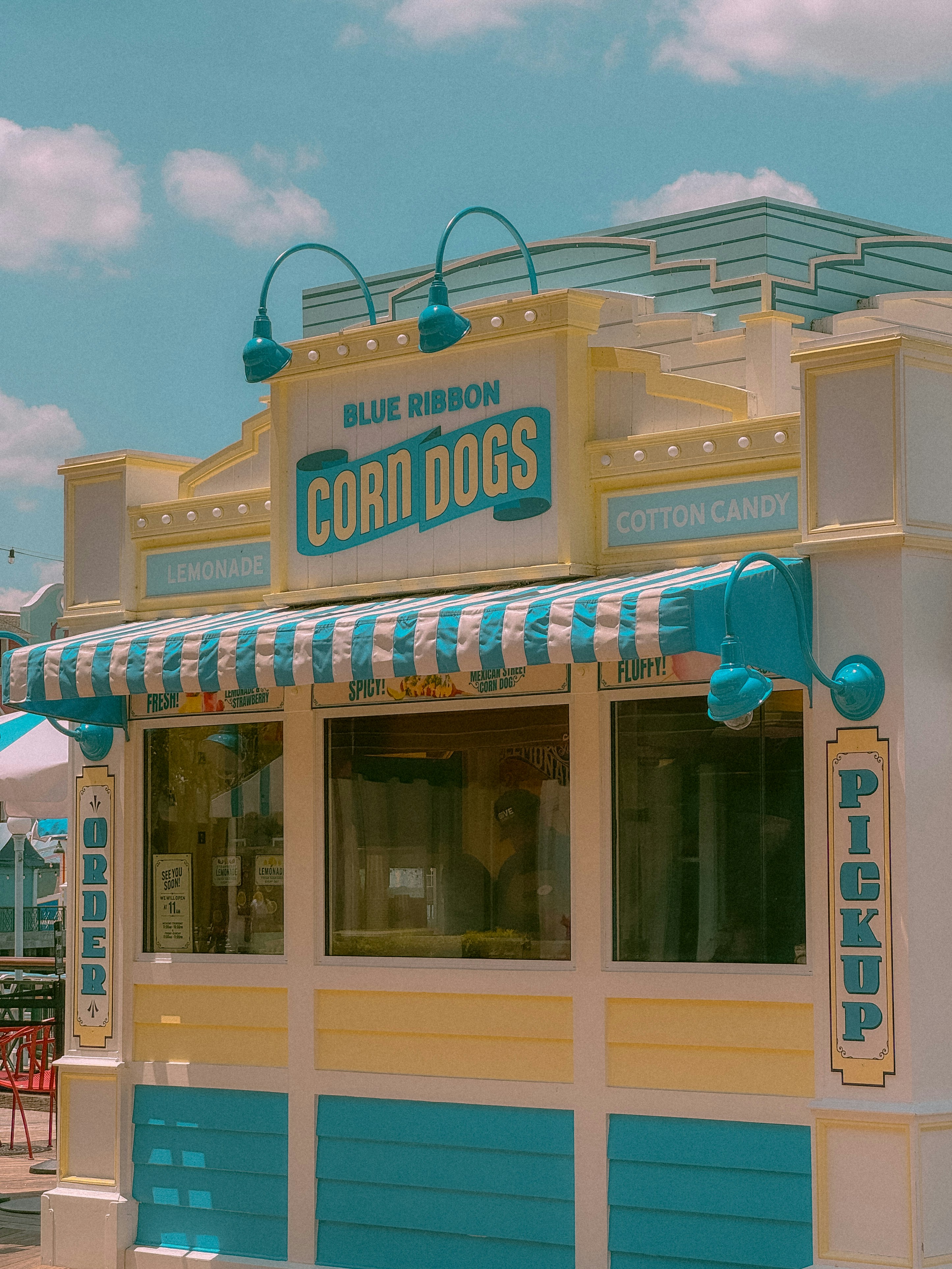 Blue Ribbon Corn Dogs: A Sunlit Pastel Kiosk on the Boardwalk
