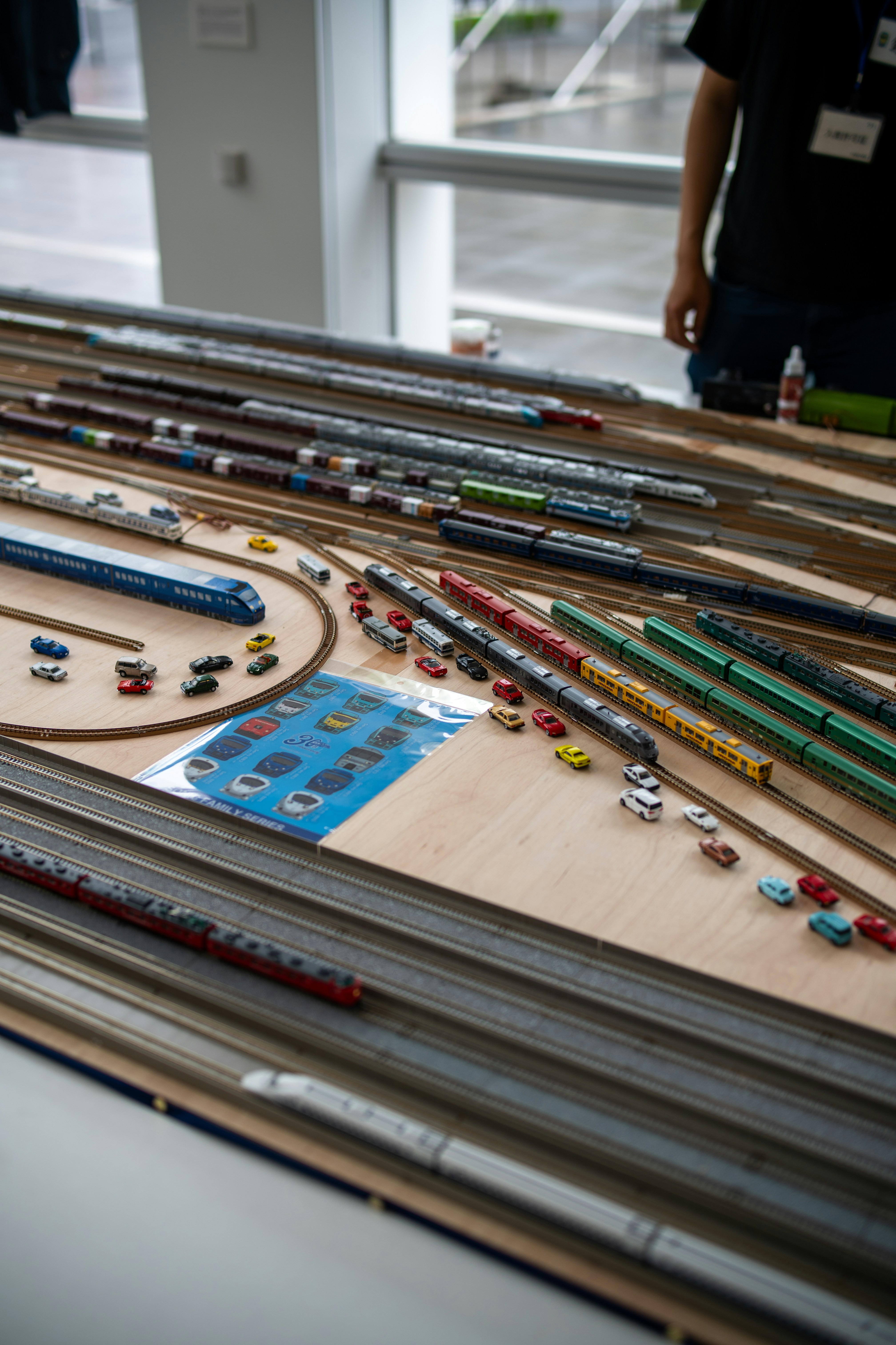 Miniature model trains sit on a track display. photo – Free Image on ...