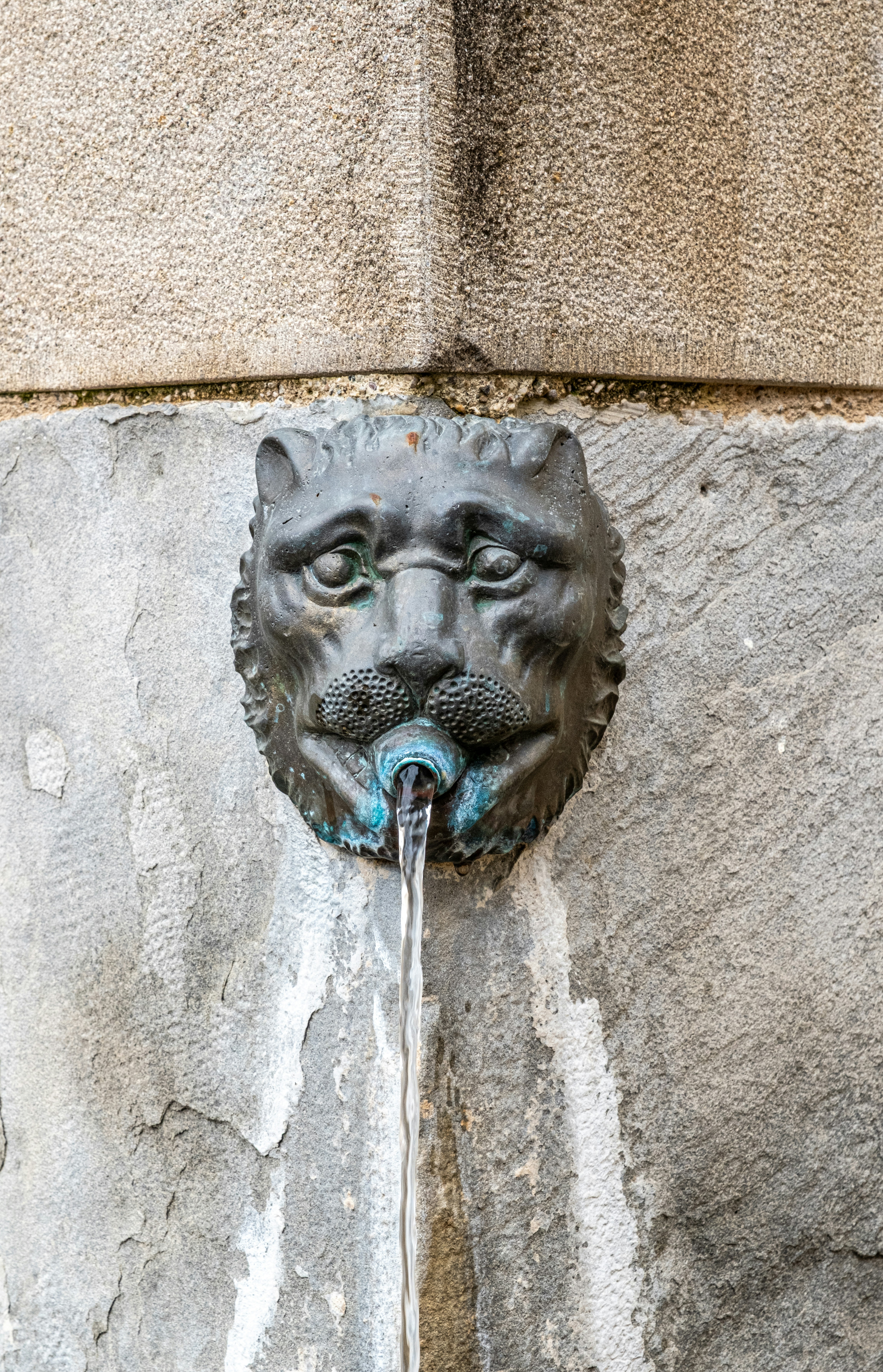 Weathered Stone Lion Fountain: Water Echoes from the Mouth