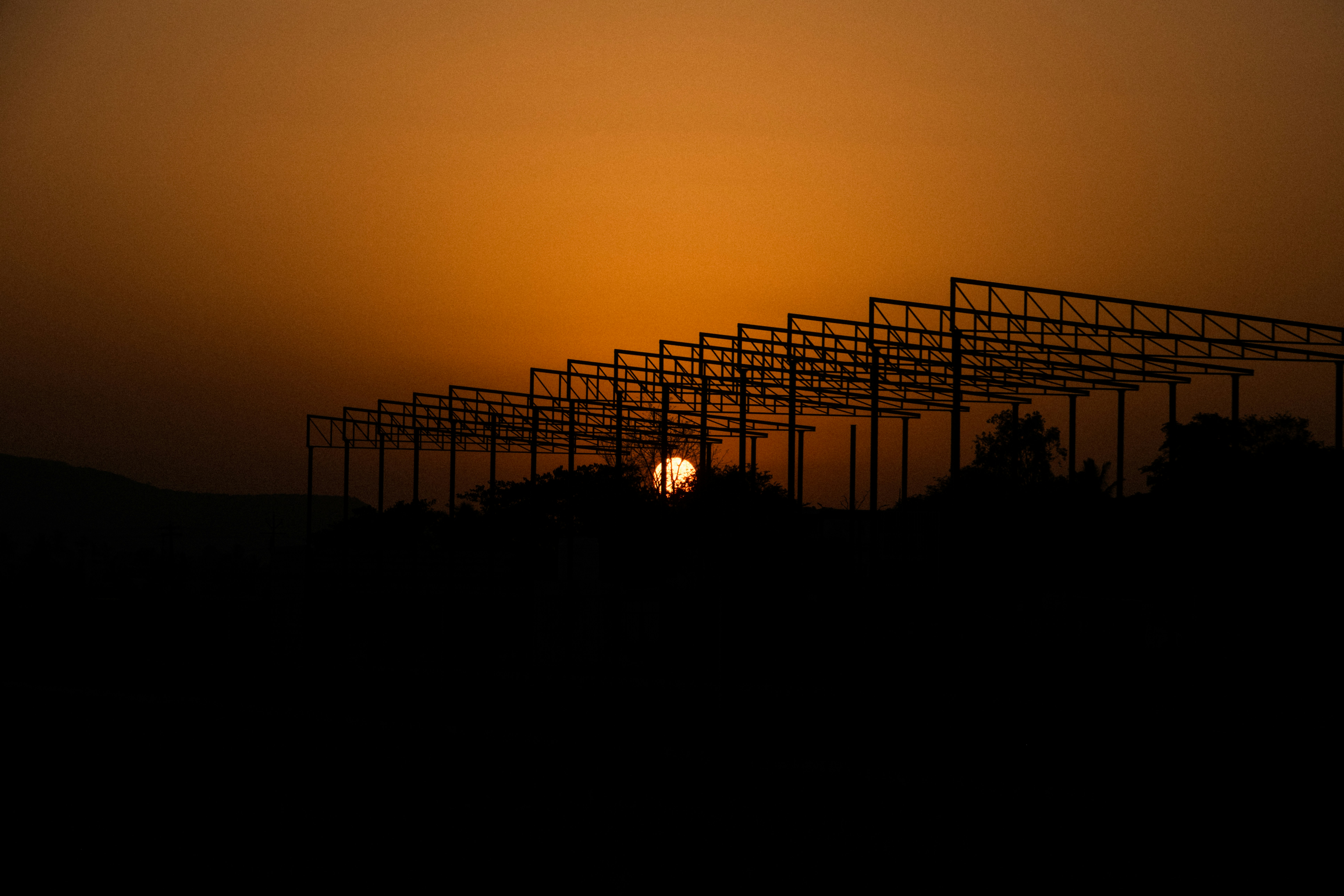 Sun-Touched Framework: Silhouettes of an Industrial Skyline at Dusk