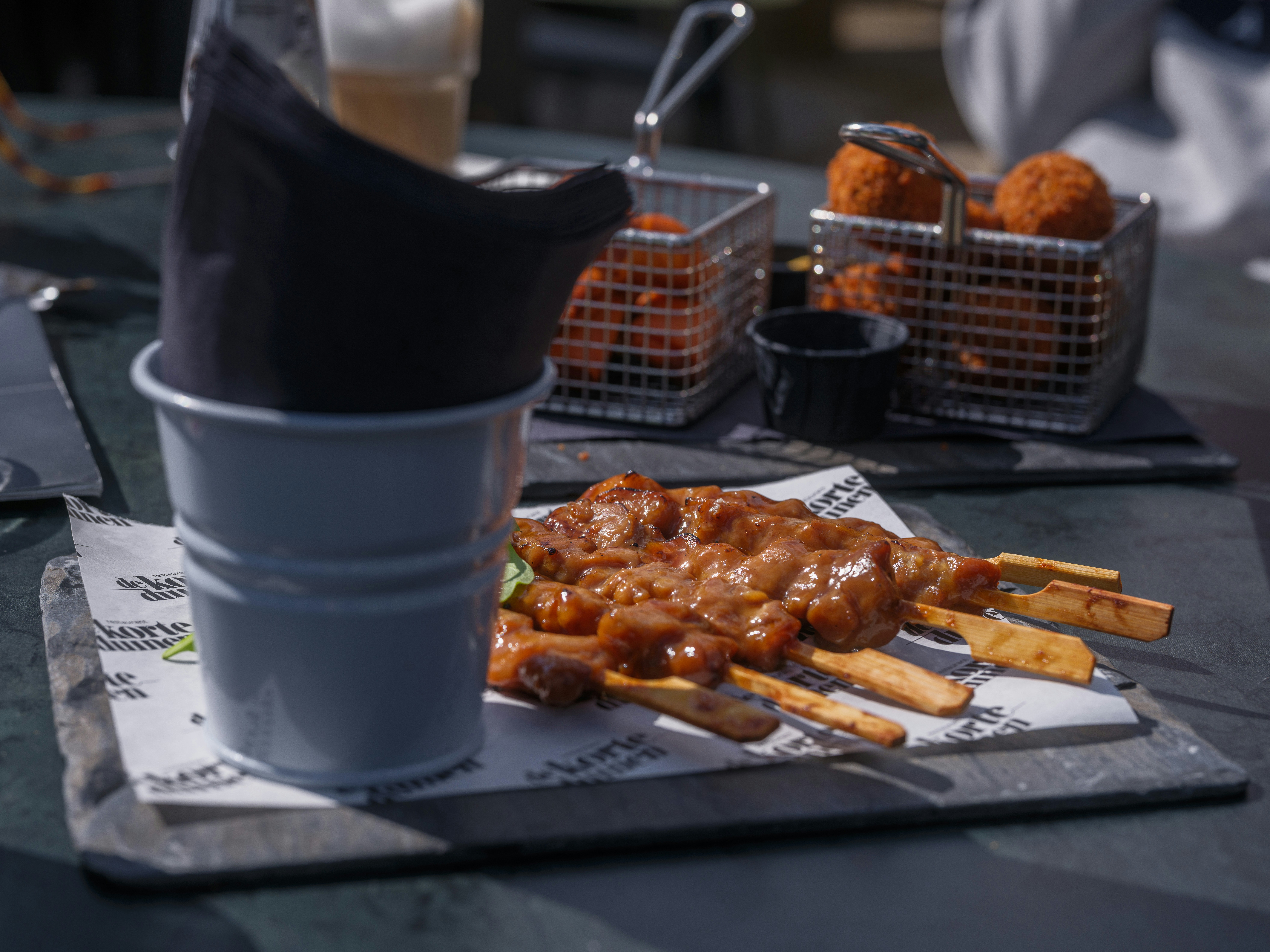 Slate-plate Sizzle: Glazed Skewers Meet Crispy Croquettes