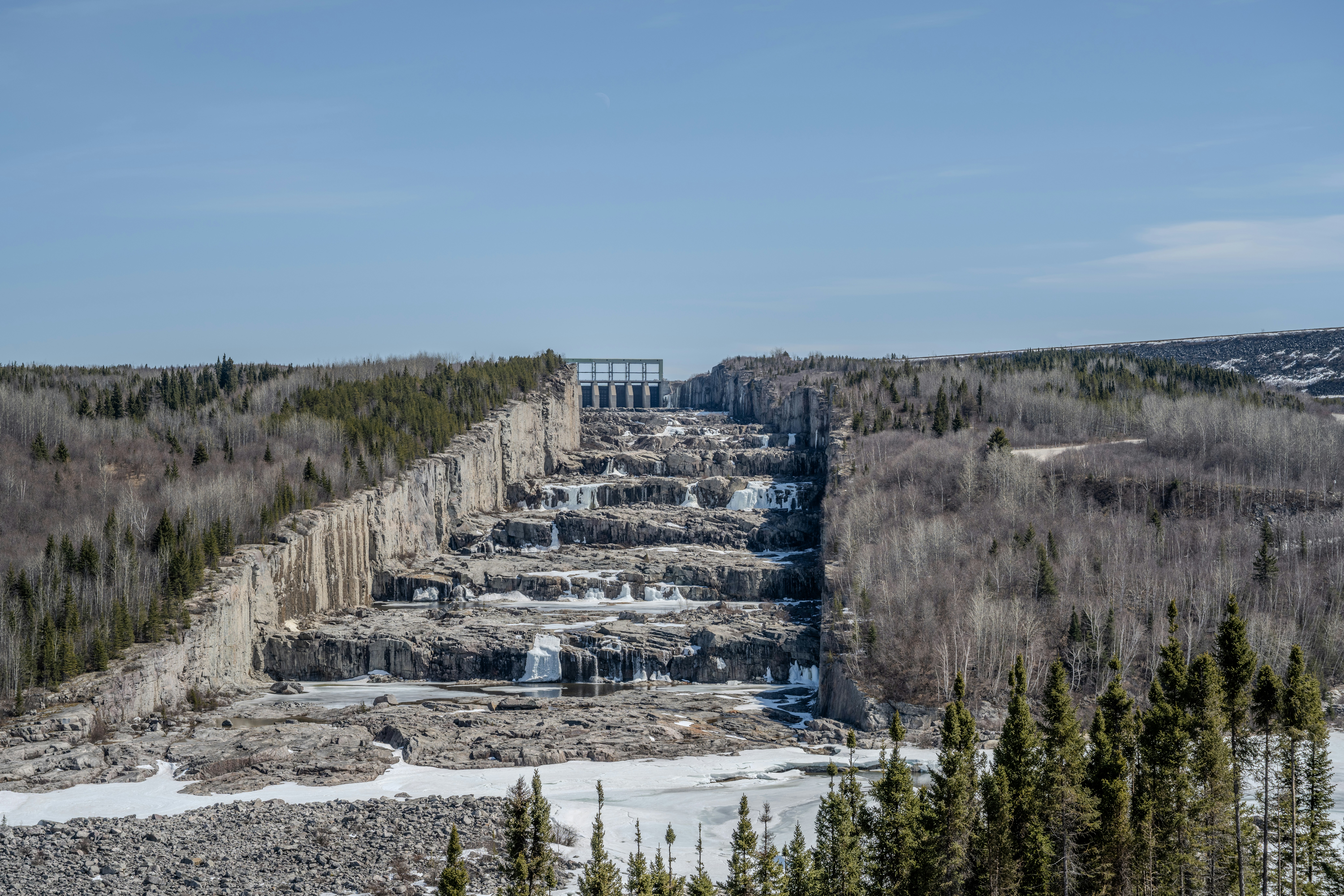 A hydroelectric dam cascading water down a rocky mountain. photo – Free ...