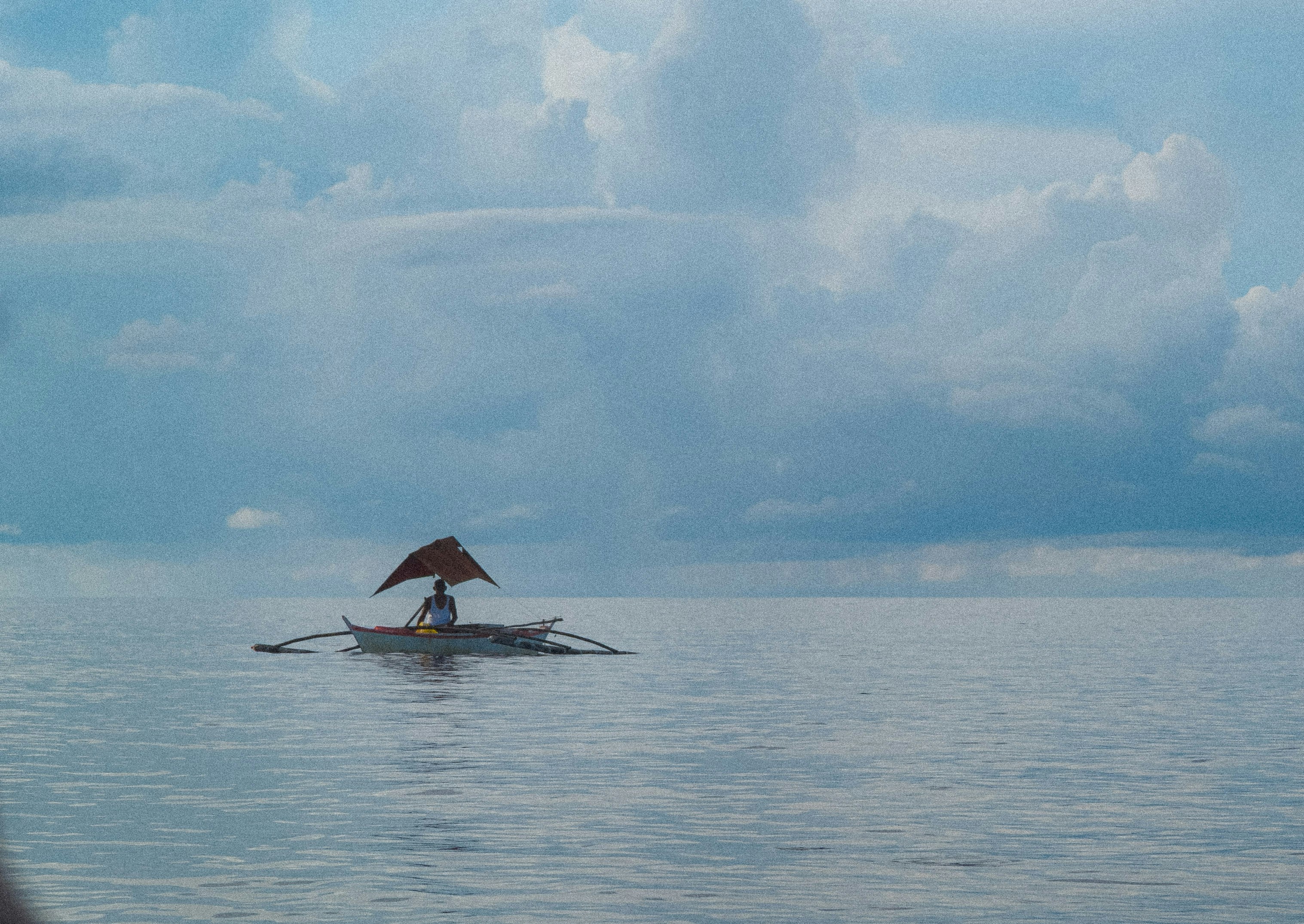 Solitary Boat under Vast Sky