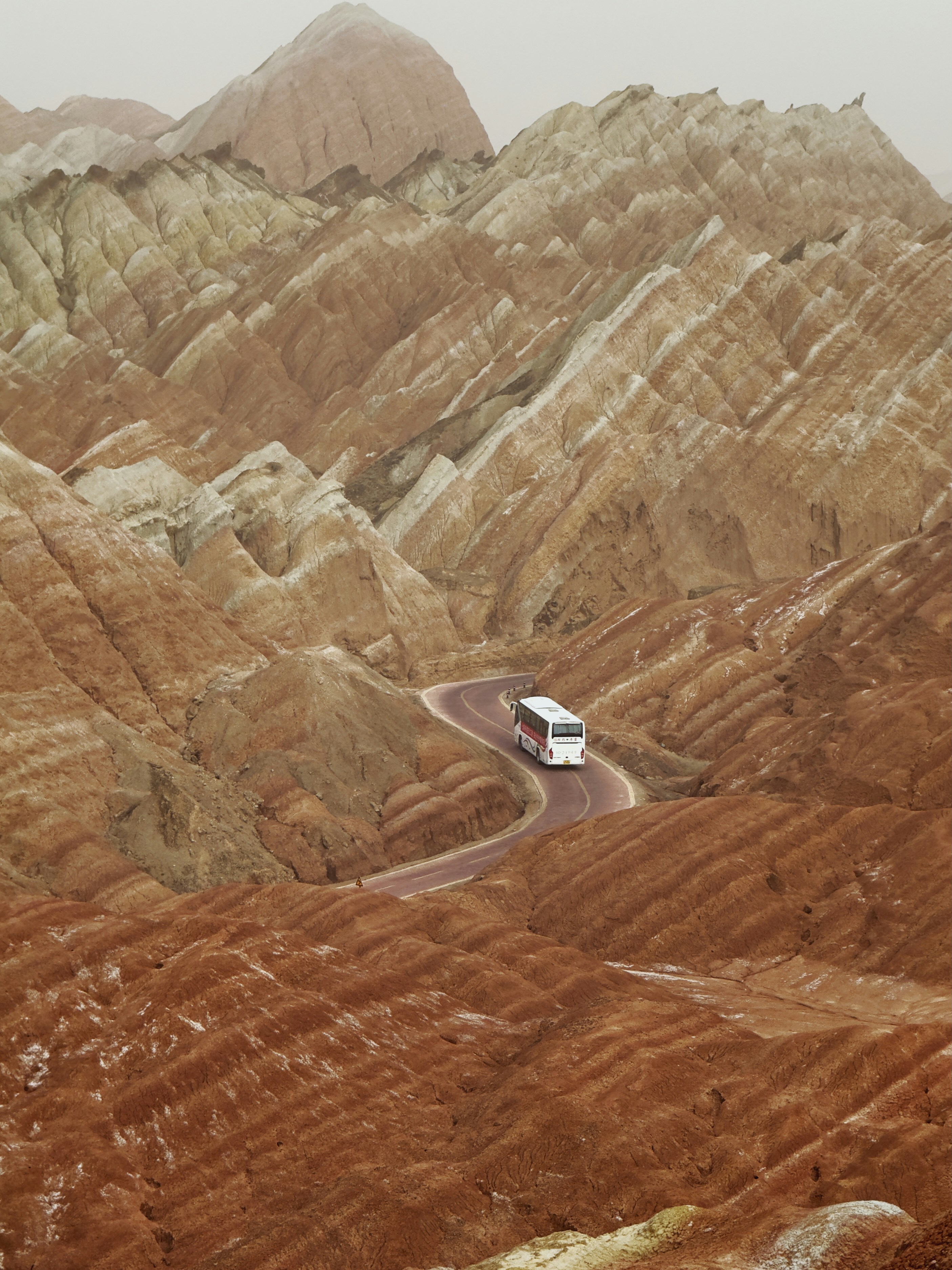 Tiny Bus on a Scarlet Ribbon: Winding Through the Painted Badlands