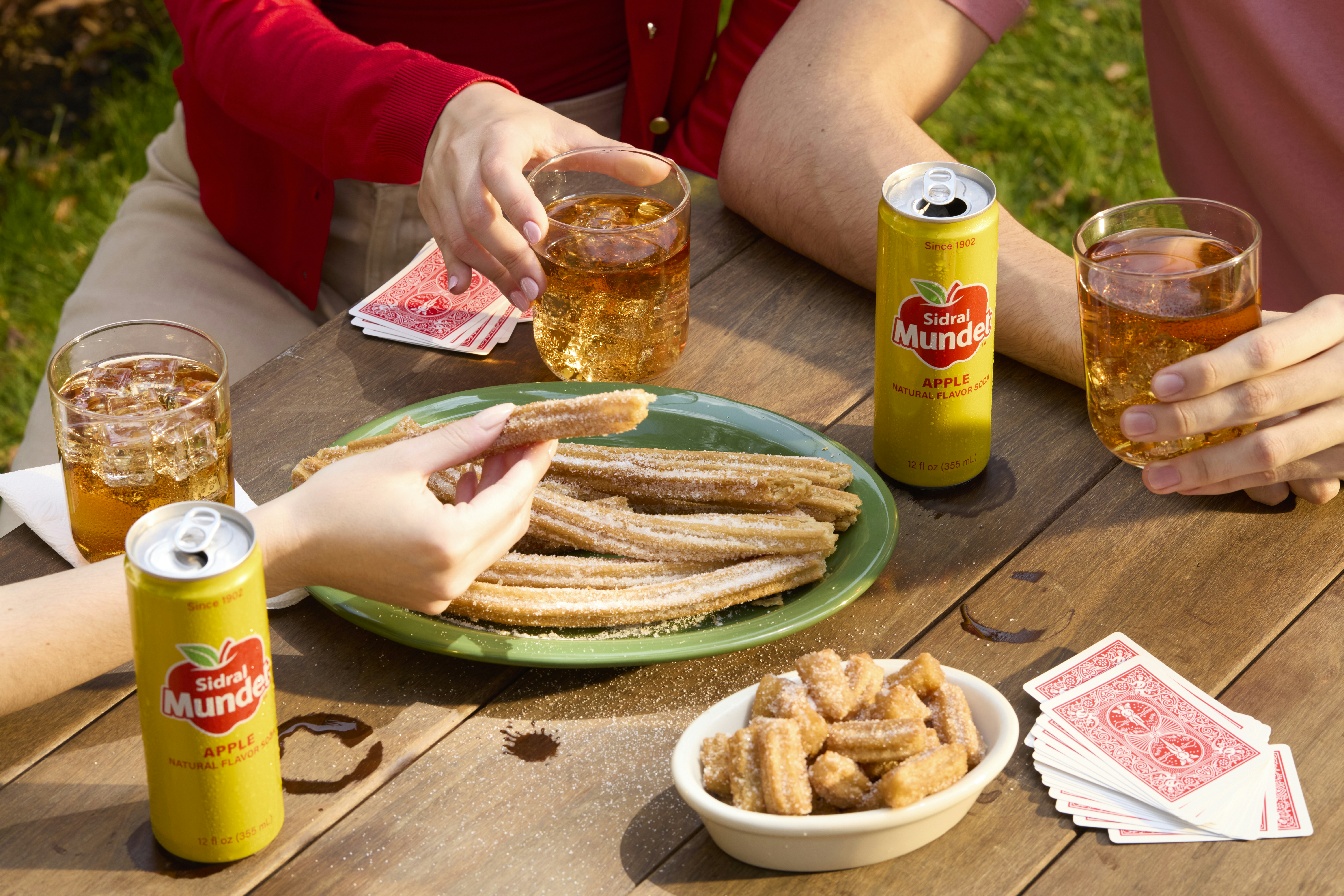 Churros and Cheers: A Sunlit Outdoor Snack Spread