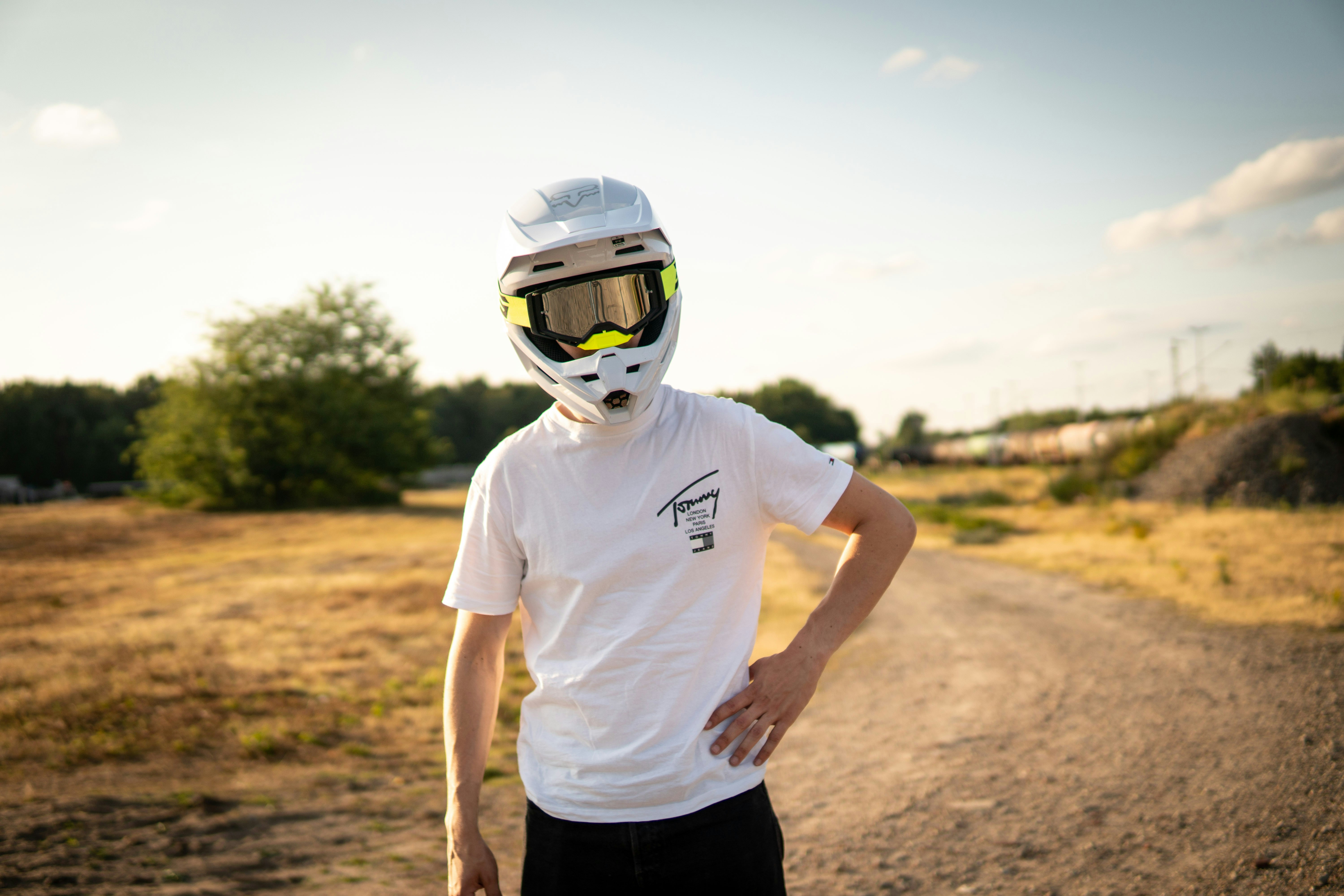 Helmeted Gaze on Dusty Road: A Quiet Portrait in Open Terrain