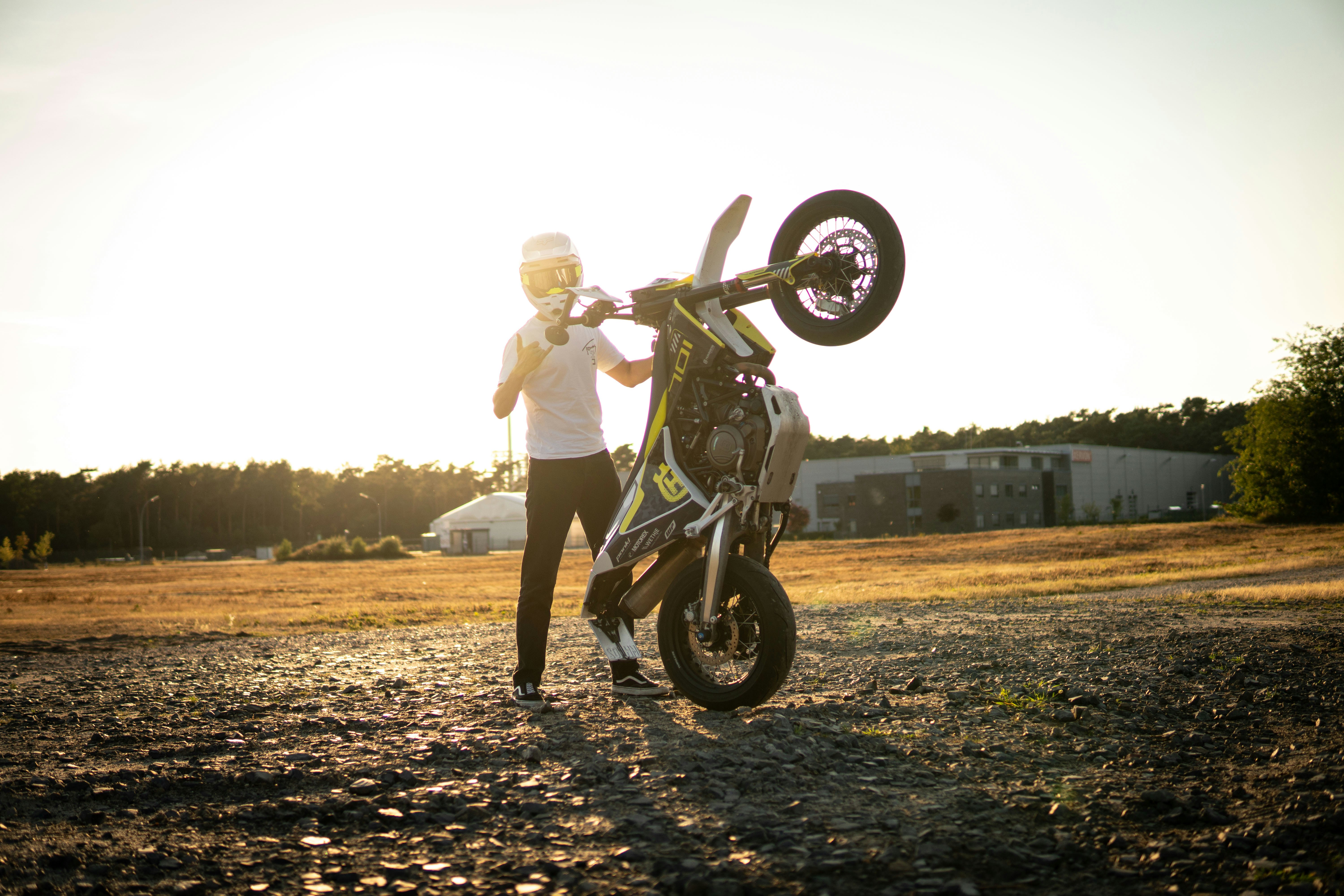 A person is doing a wheelie with a motorcycle. photo – Free Freedom ...