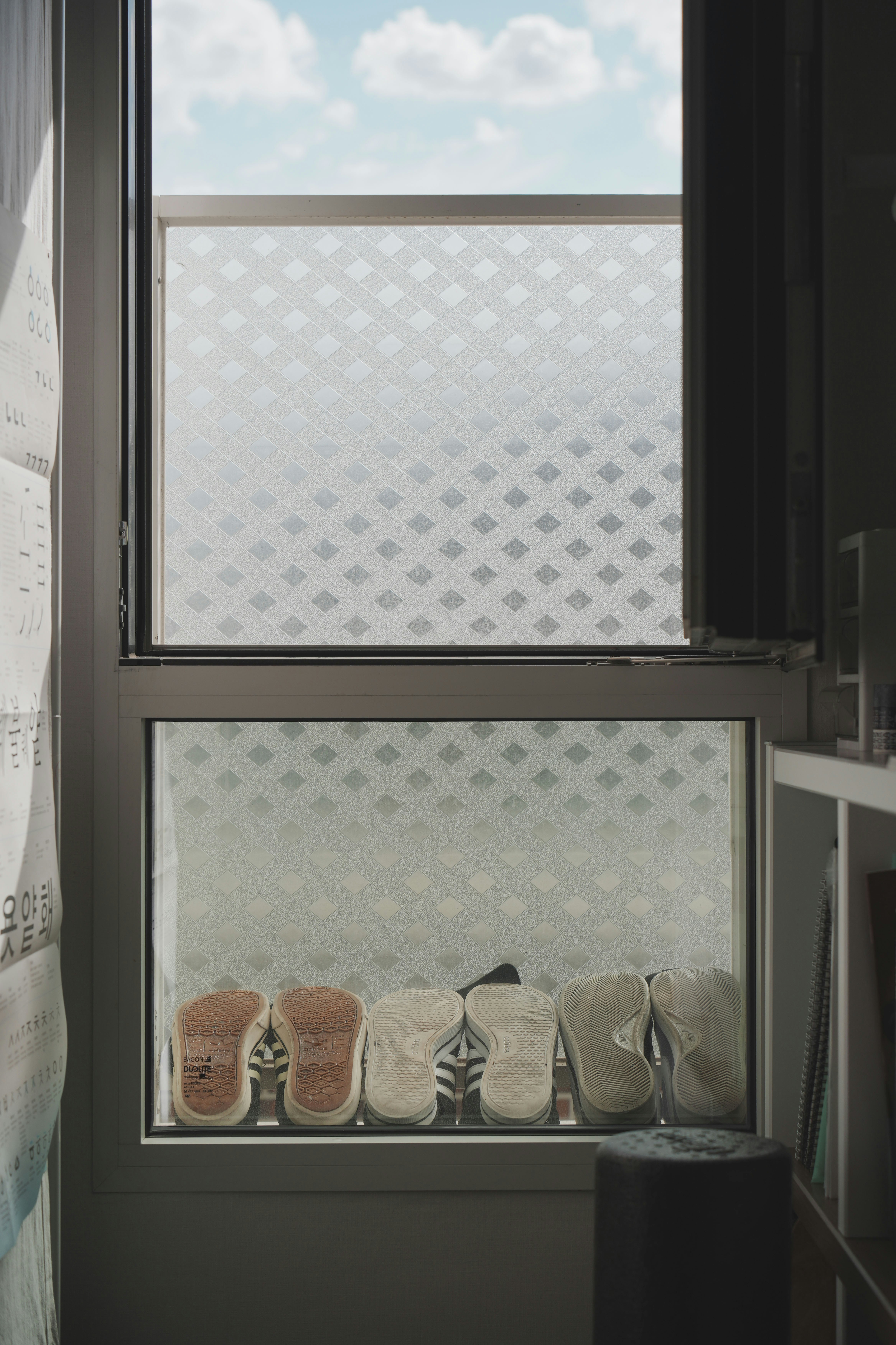 Sneaker Row Against Frosted Glass: Quiet Morning by the Window