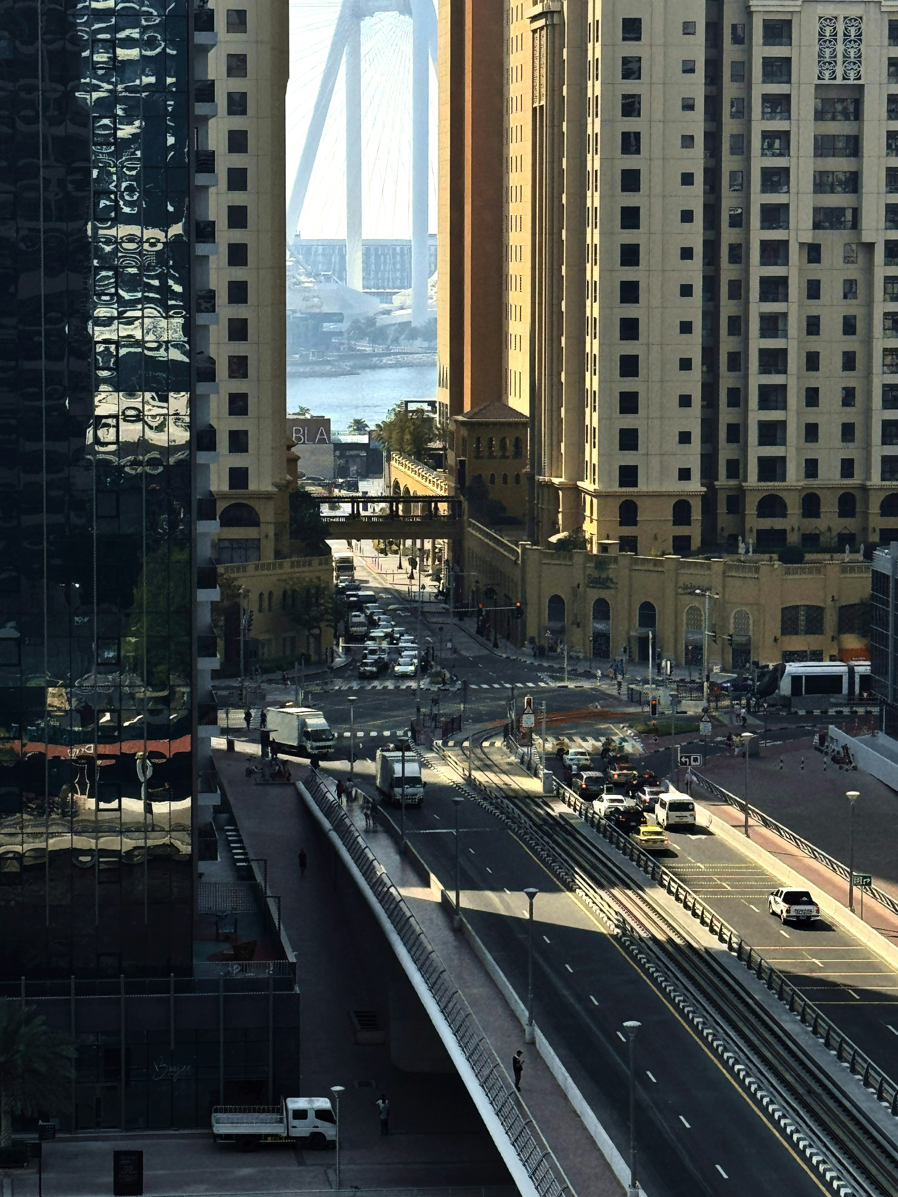 High-rise buildings line a bustling city street. photo – Free Building ...