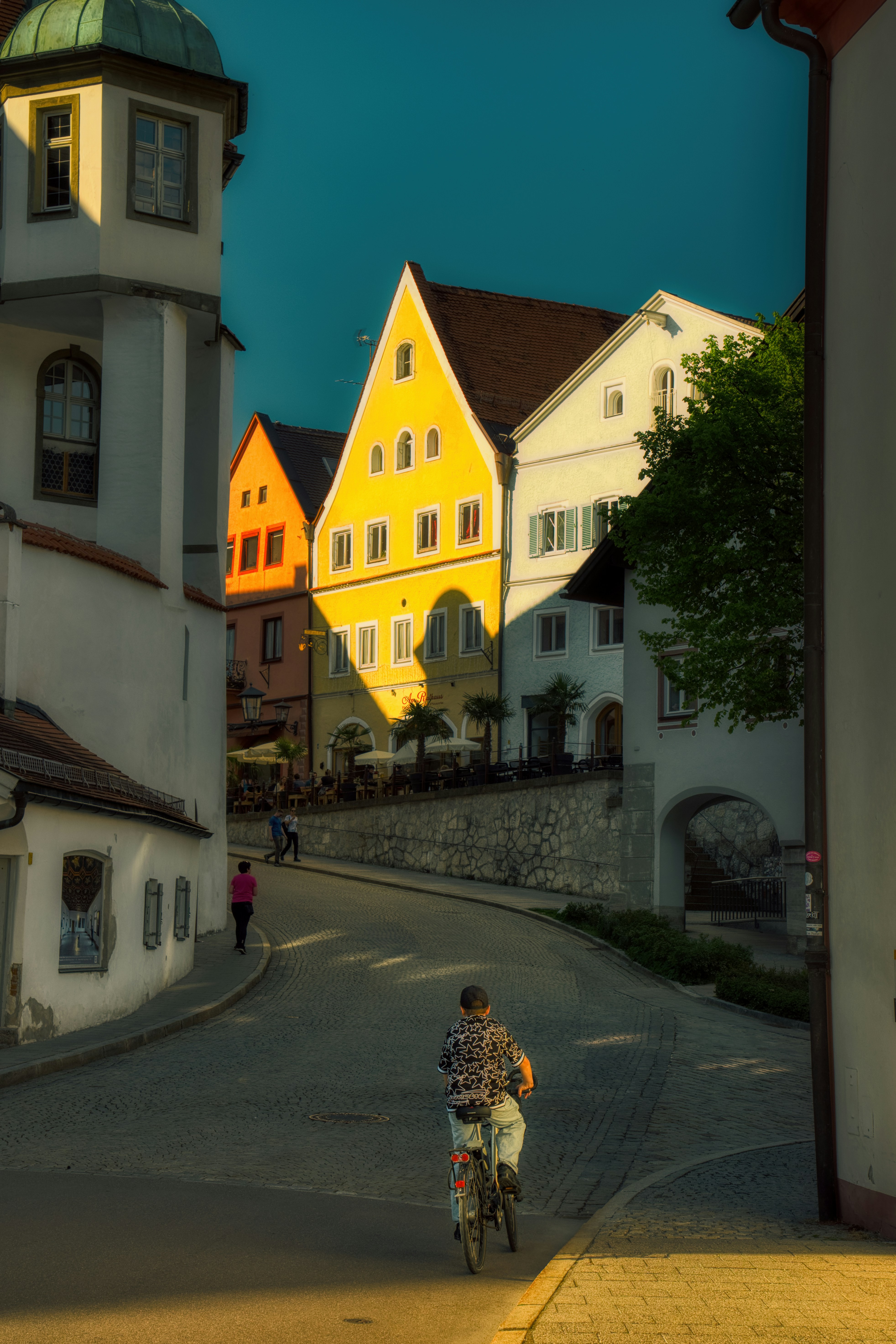 Golden Gable Lane: Sunlit Facades in a Colorful European Quarter