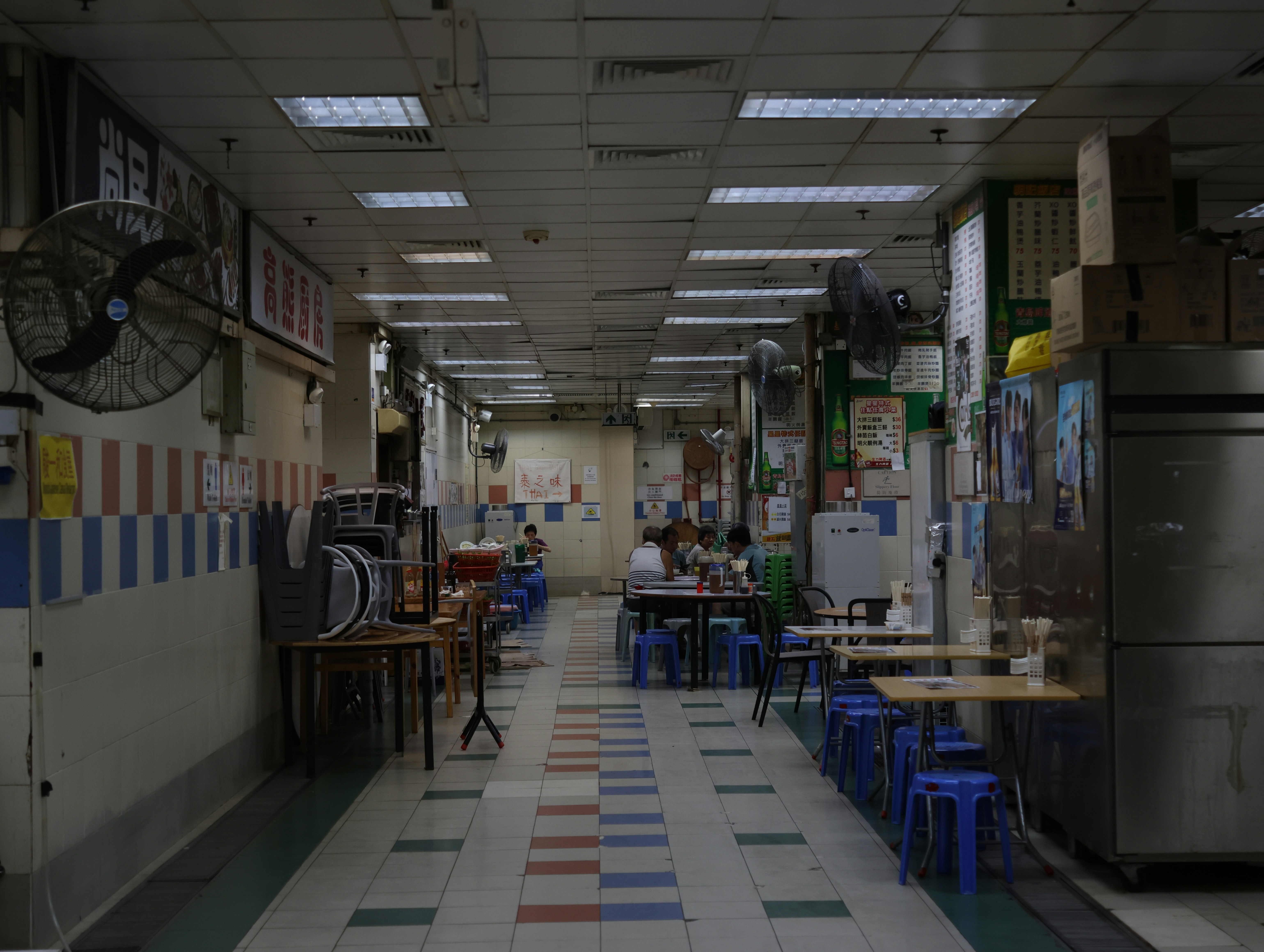 A narrow restaurant with seating and supplies. photo – Free Image on ...