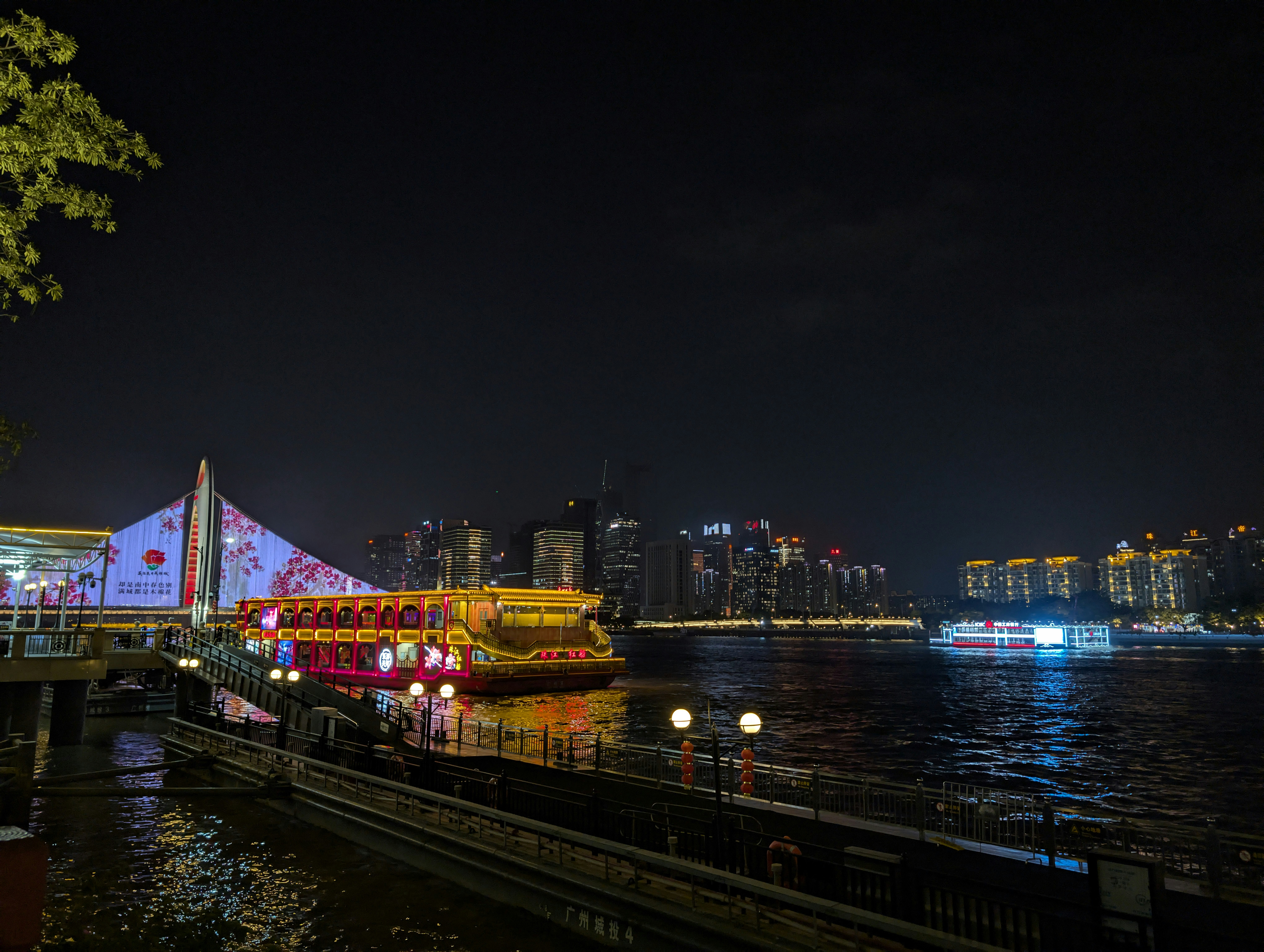 Neon Harbor at Night: A Yellow Boat Illuminated Against the City’s Reflective Waterfront