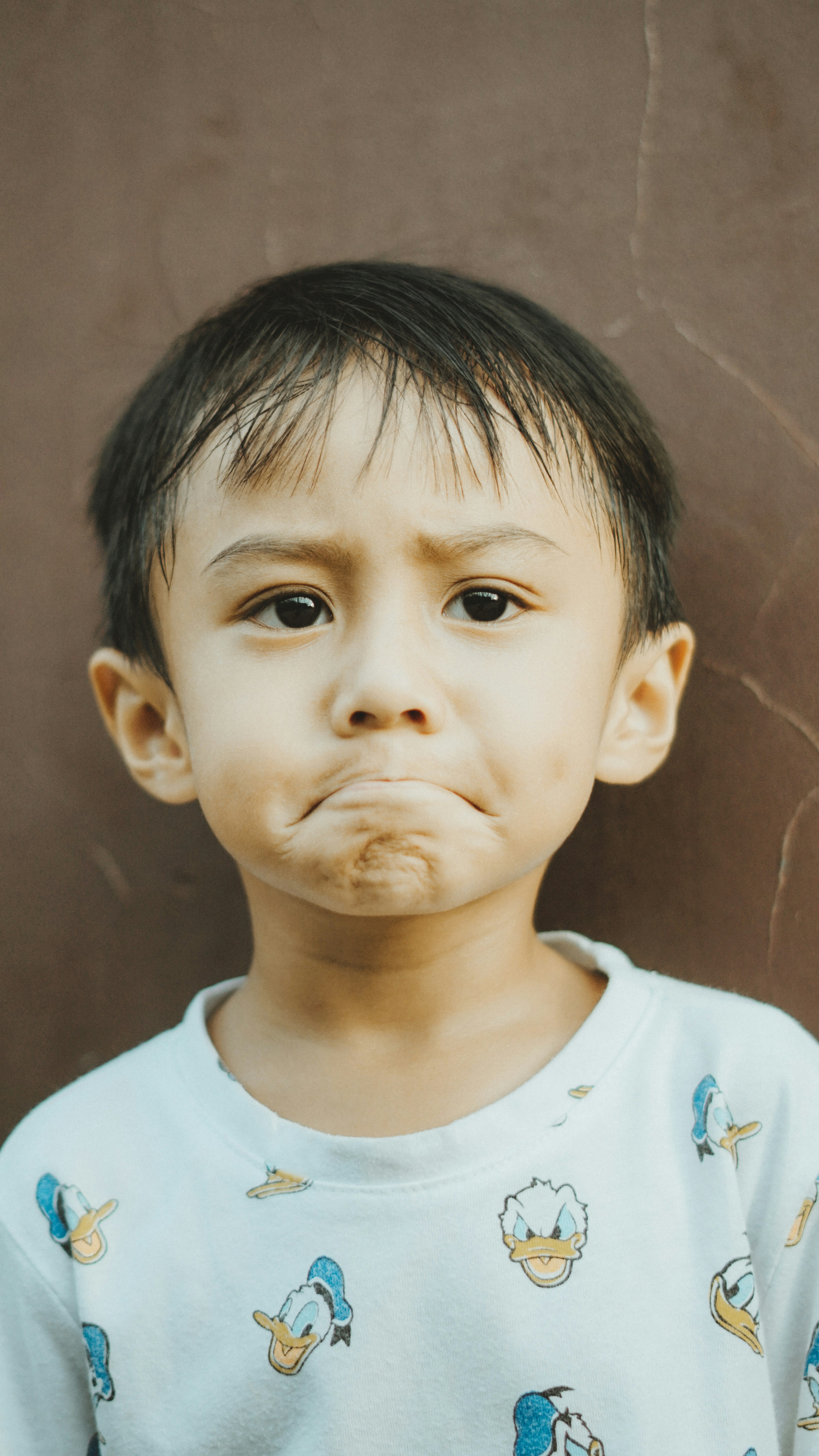 The young boy looks sad with a pouting expression. photo – Free Face ...