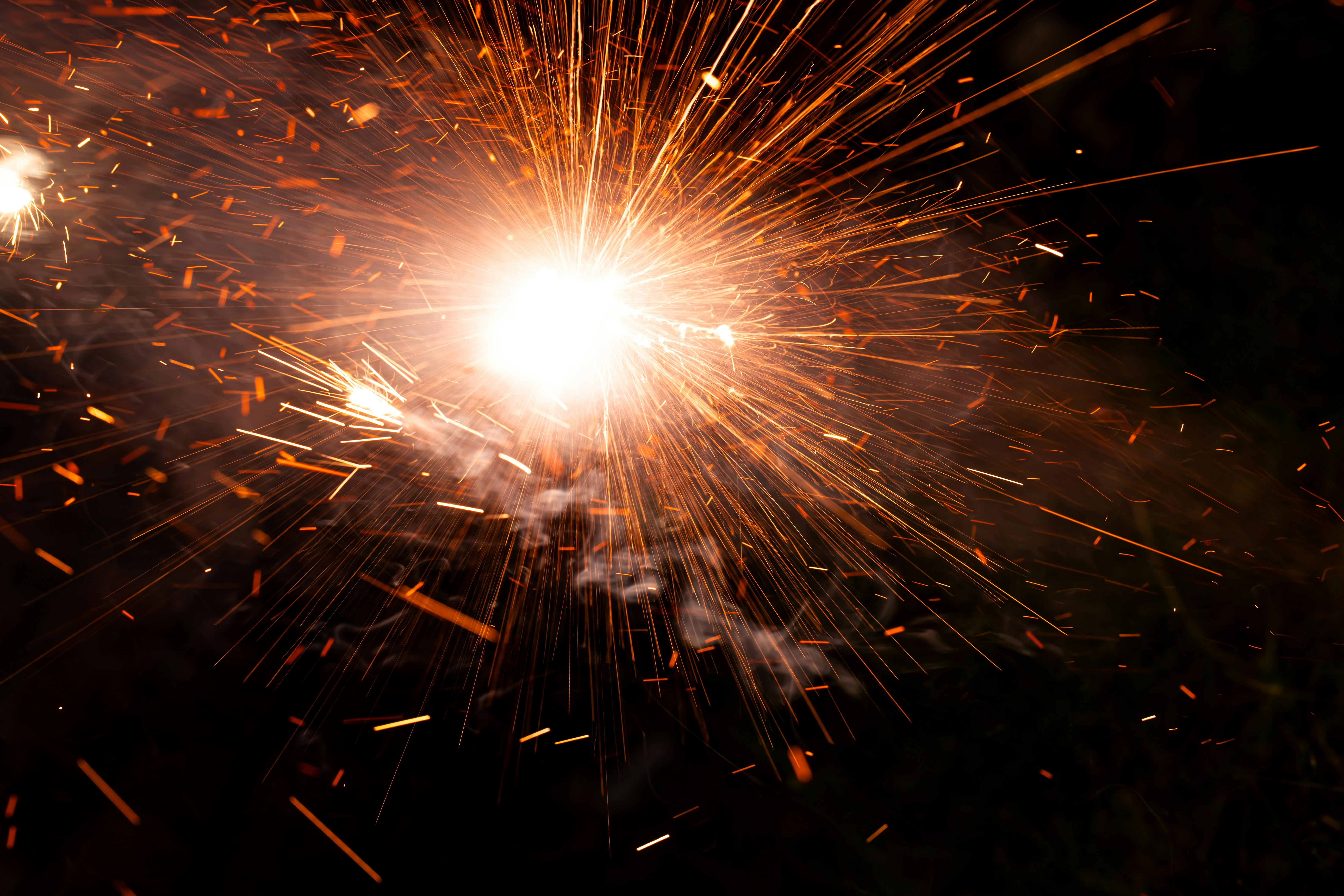 A firework bursts brightly in the dark sky. photo – Free Firecrackers ...