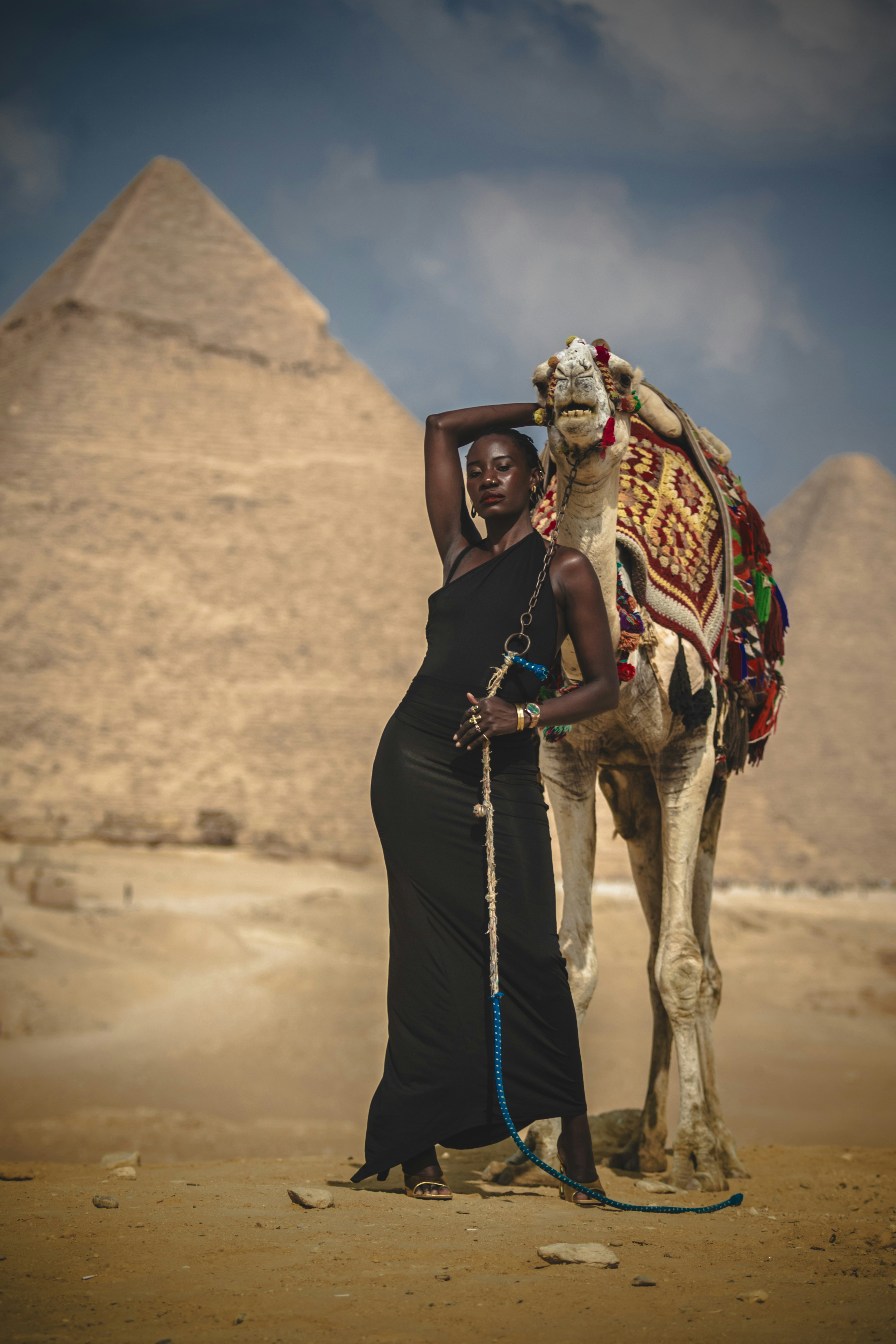 Woman poses with a camel near the pyramids. photo – Free Model Image on ...
