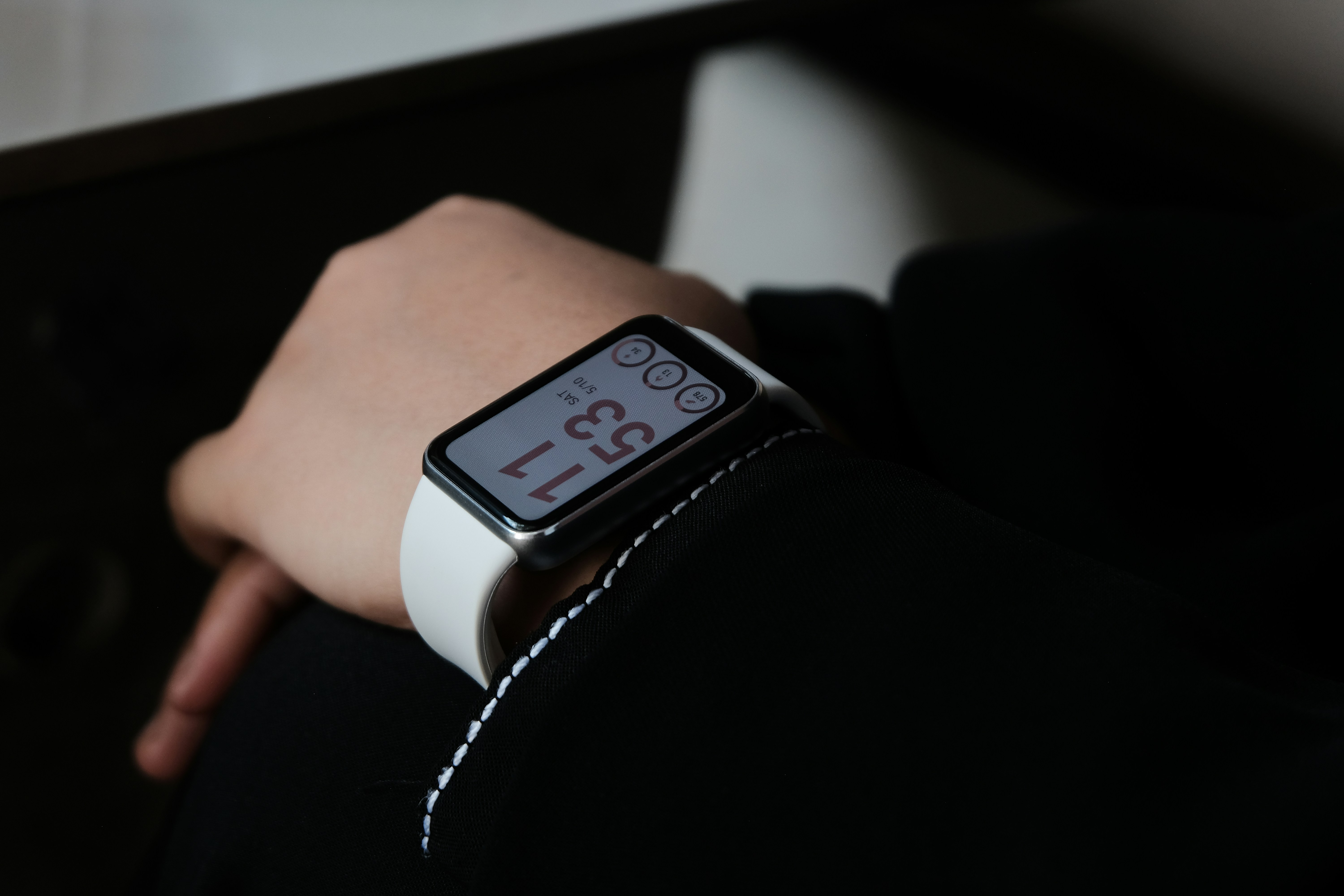 A person wearing a smartwatch with white band. photo – Free Watch Image ...