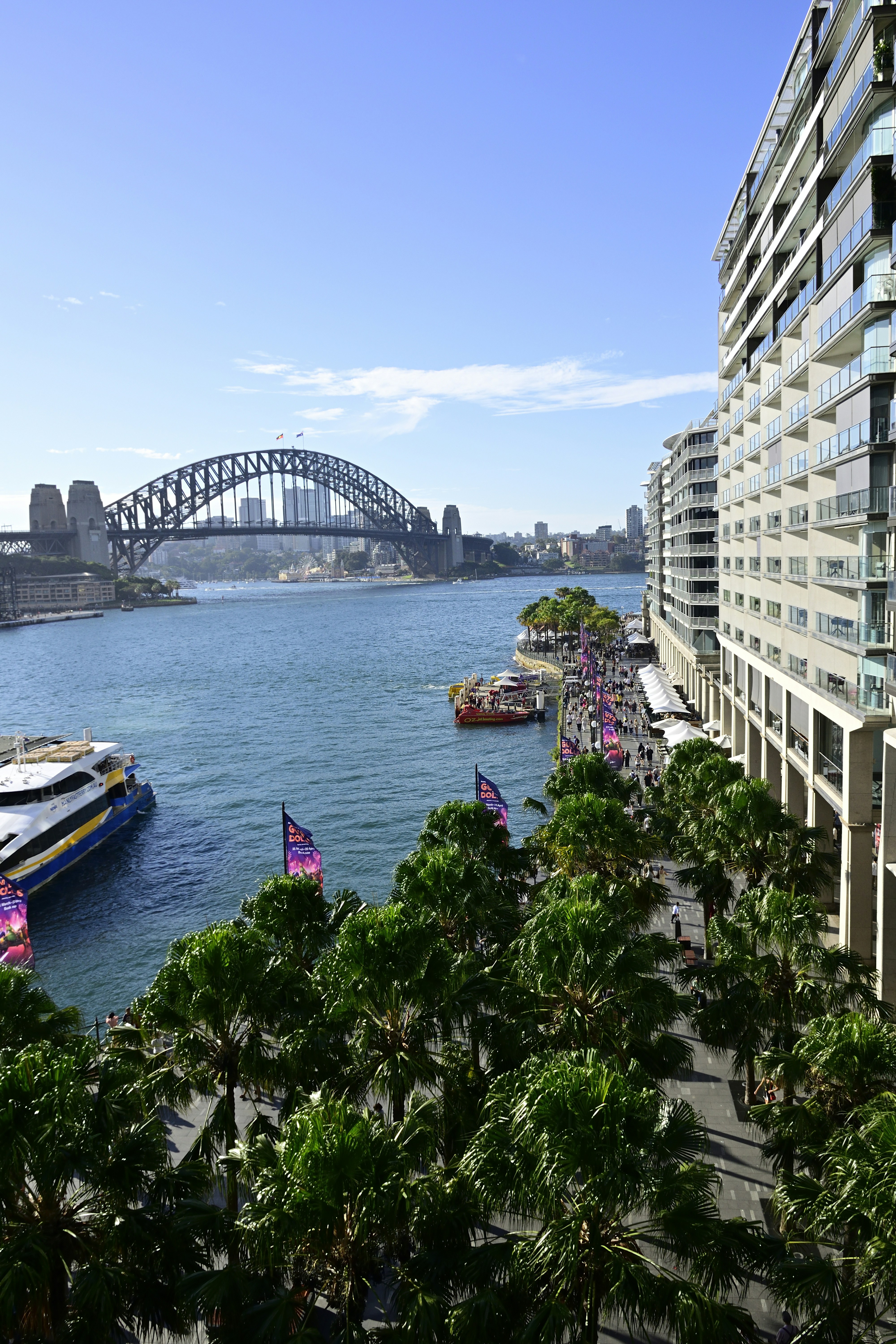 Harbor Promenade Under the Arch: A City Waterfront Scene