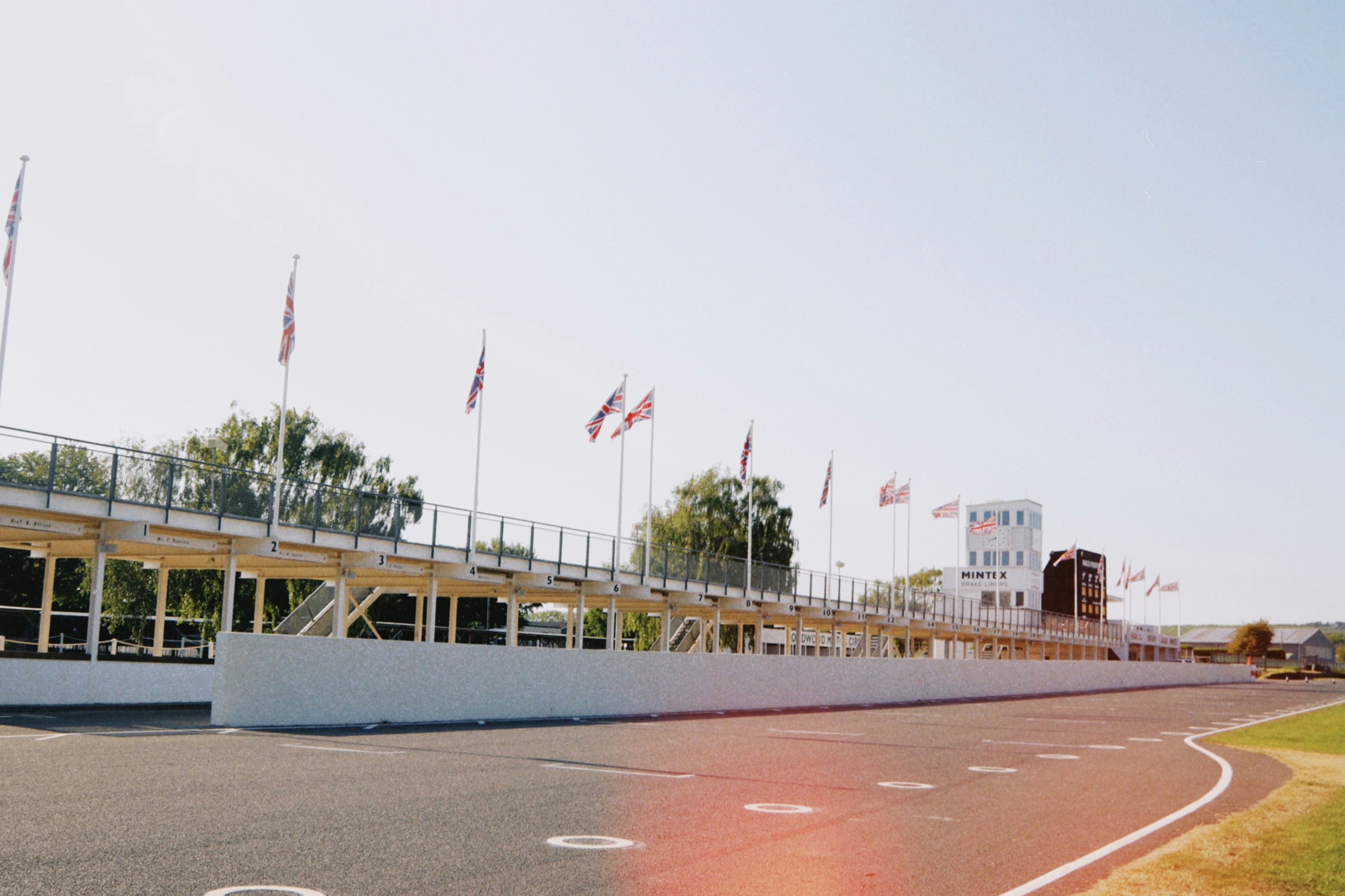 Race track with flags and a tower. photo – Free Image on Unsplash