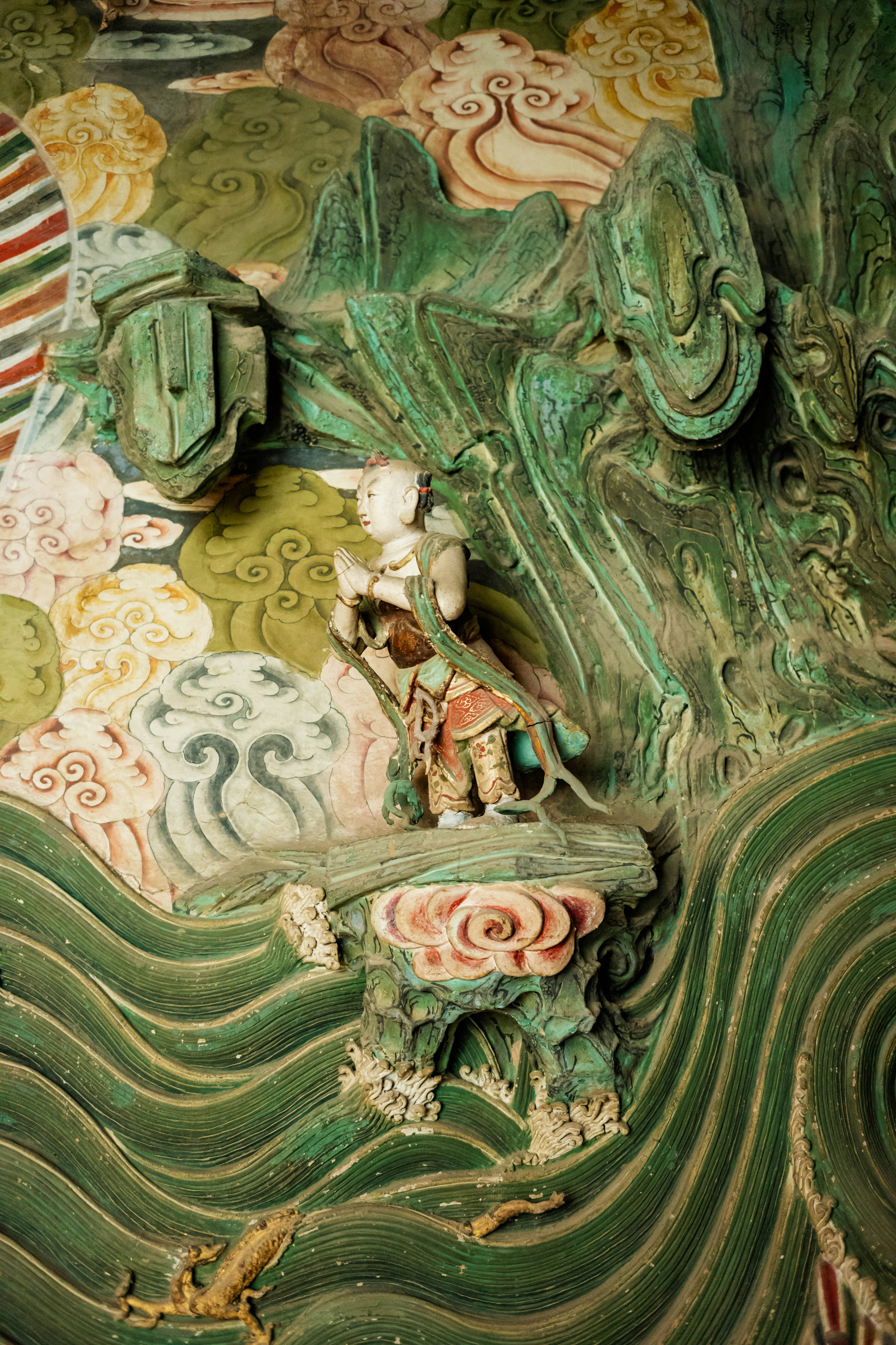 Emerald Wave Sentinel: A Tiny Warrior Among Green Carvings