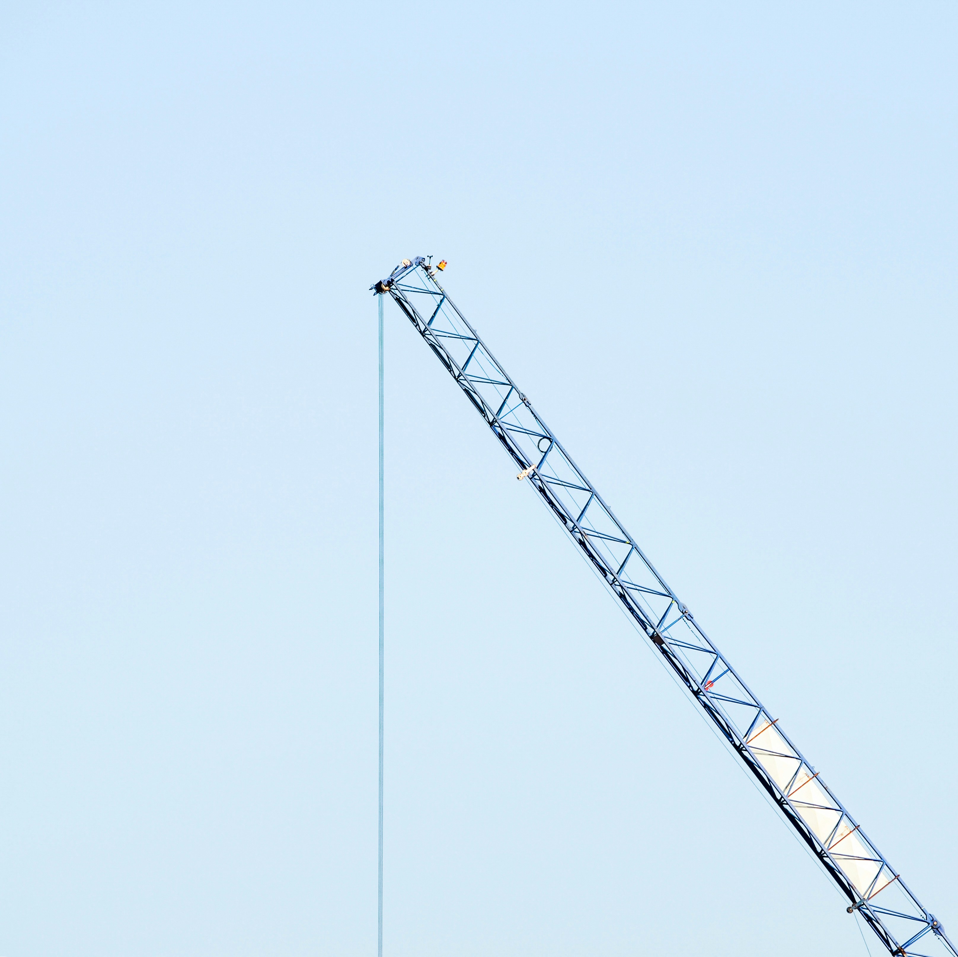 A crane's arm reaches towards the sky. photo – Free Architecture Image ...