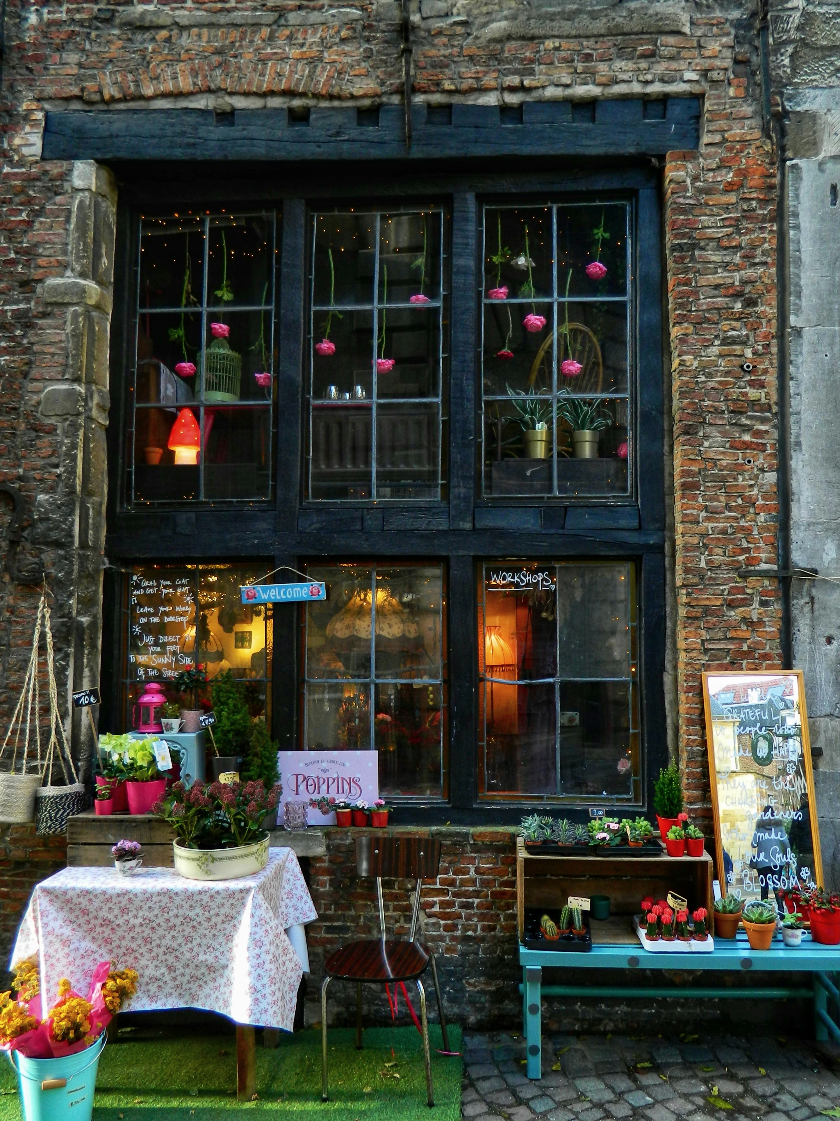 A charming flower shop with detailed window display. photo – Free ...