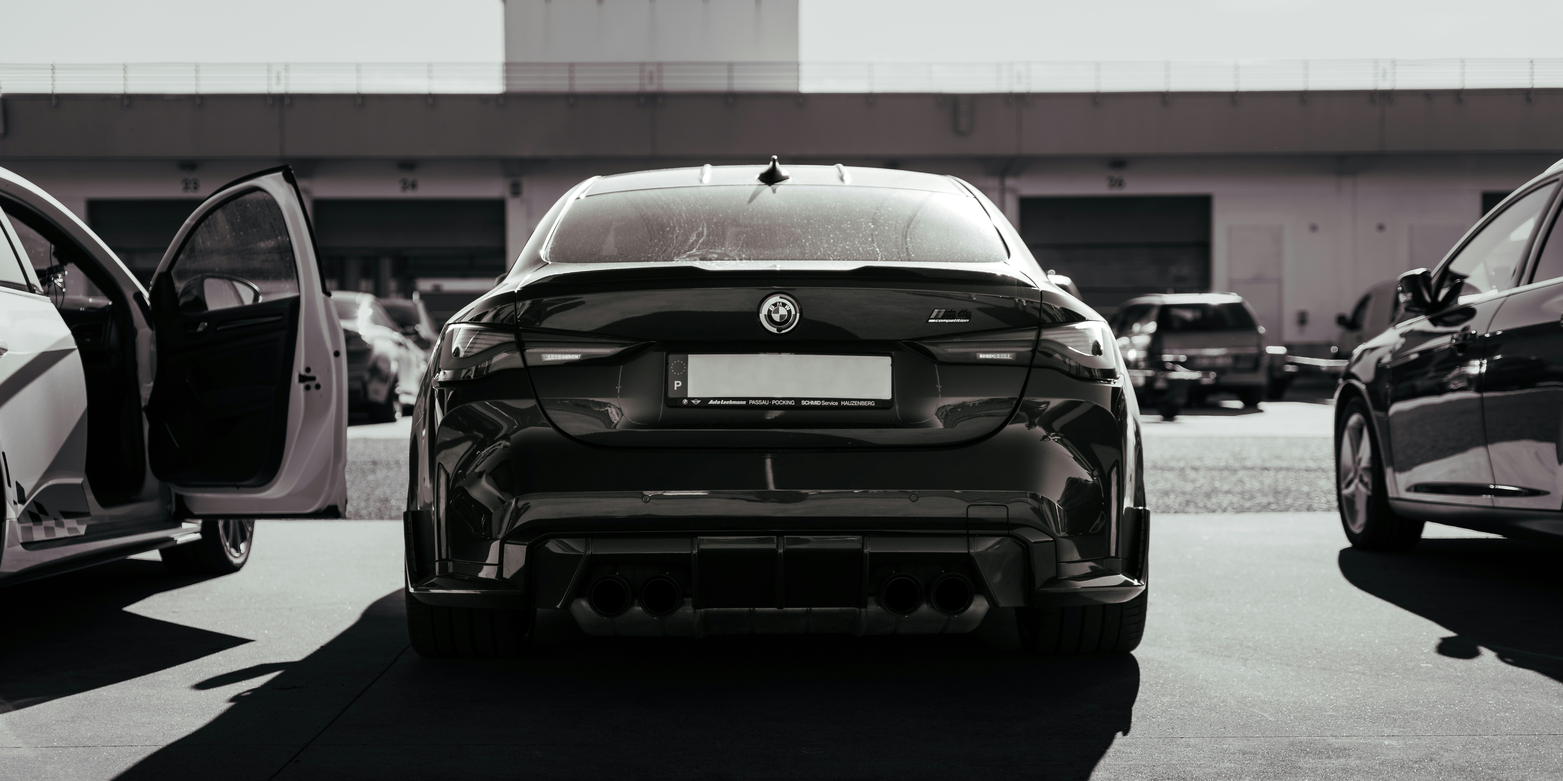 Black BMW m4 rear view, in monochrome. photo – Free Portugal Image on ...