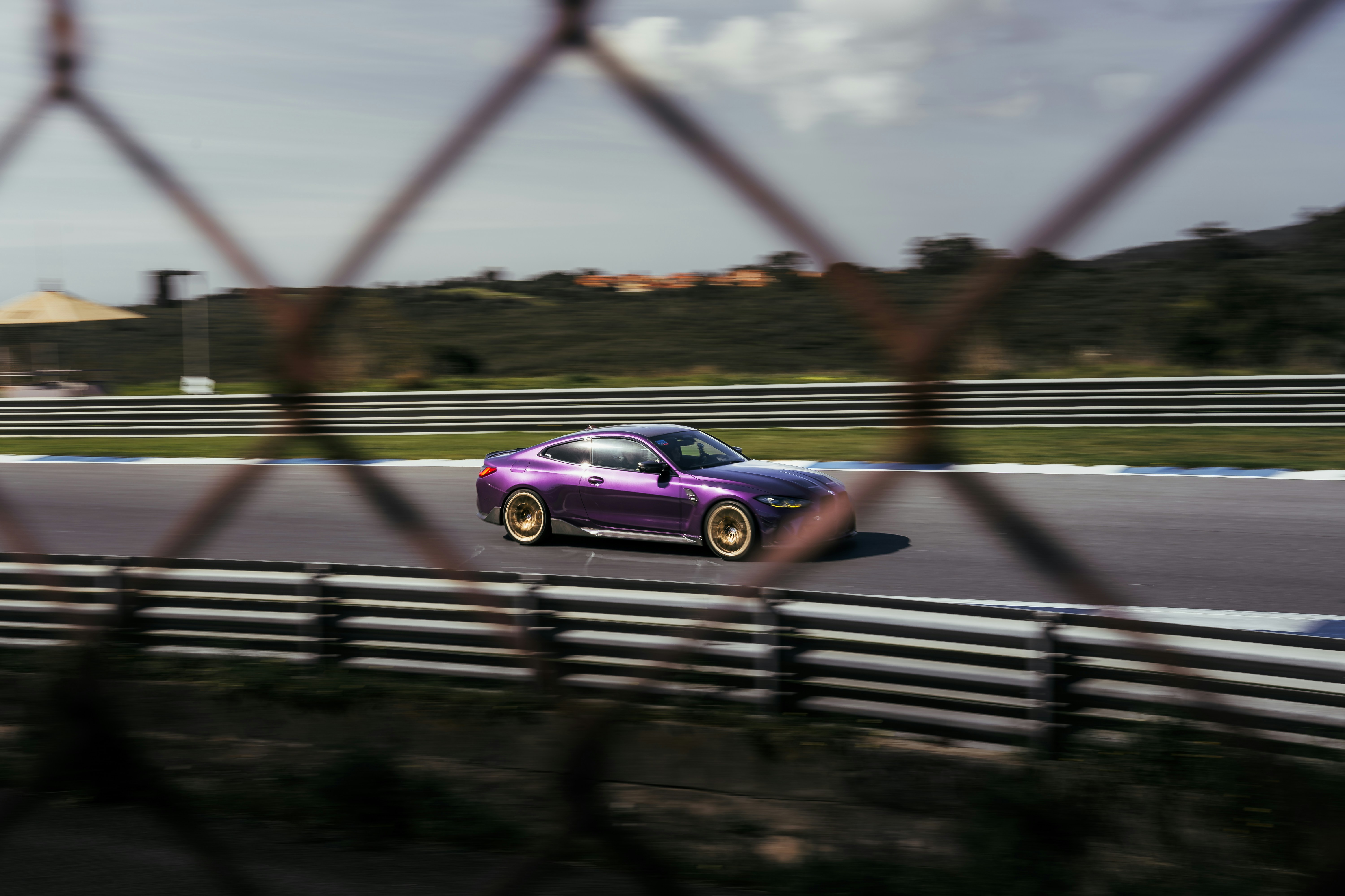 A purple car races around a racetrack. photo – Free Portugal Image on ...