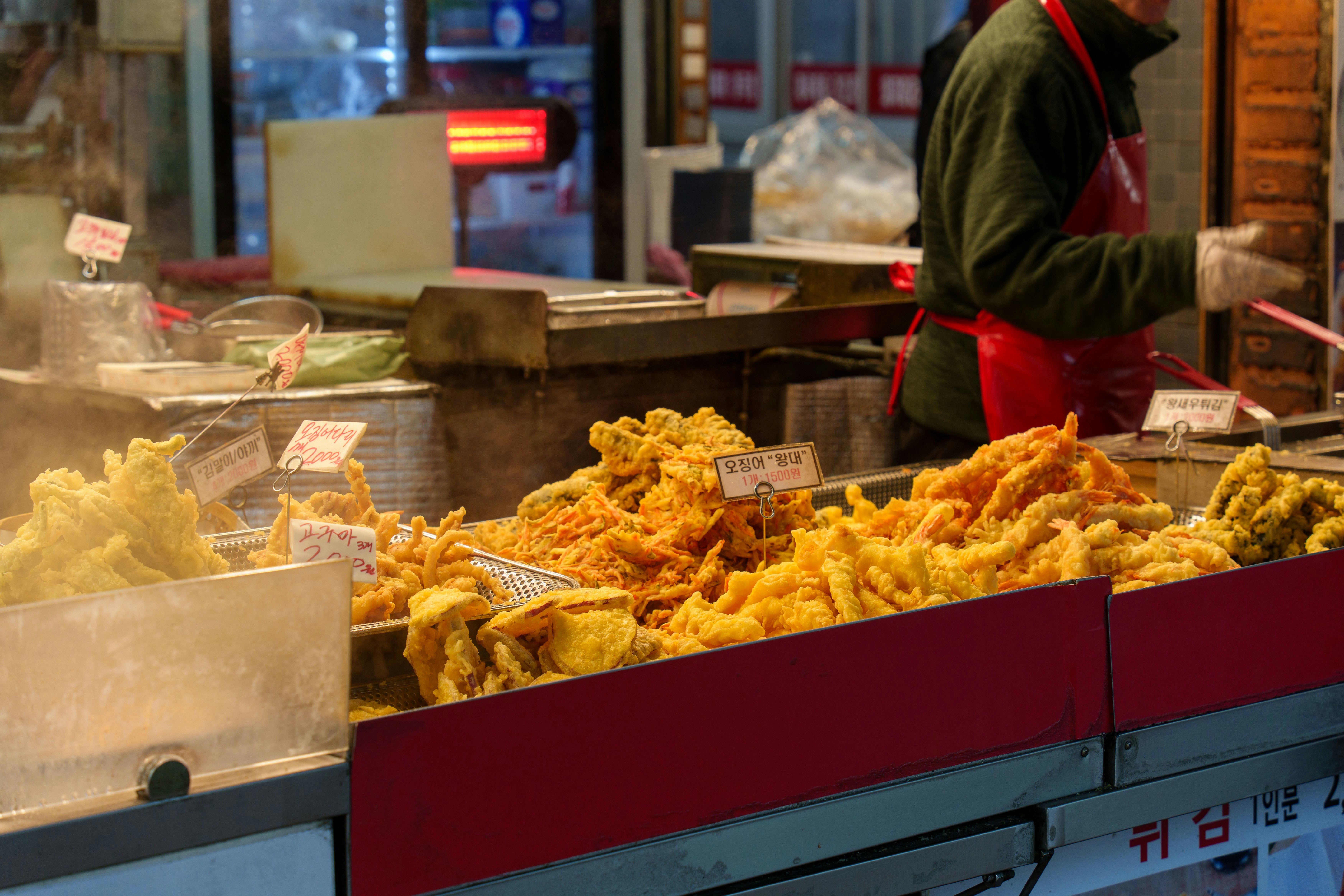 Neon Glow and Golden Crunch at a Busy Street Fry Stand