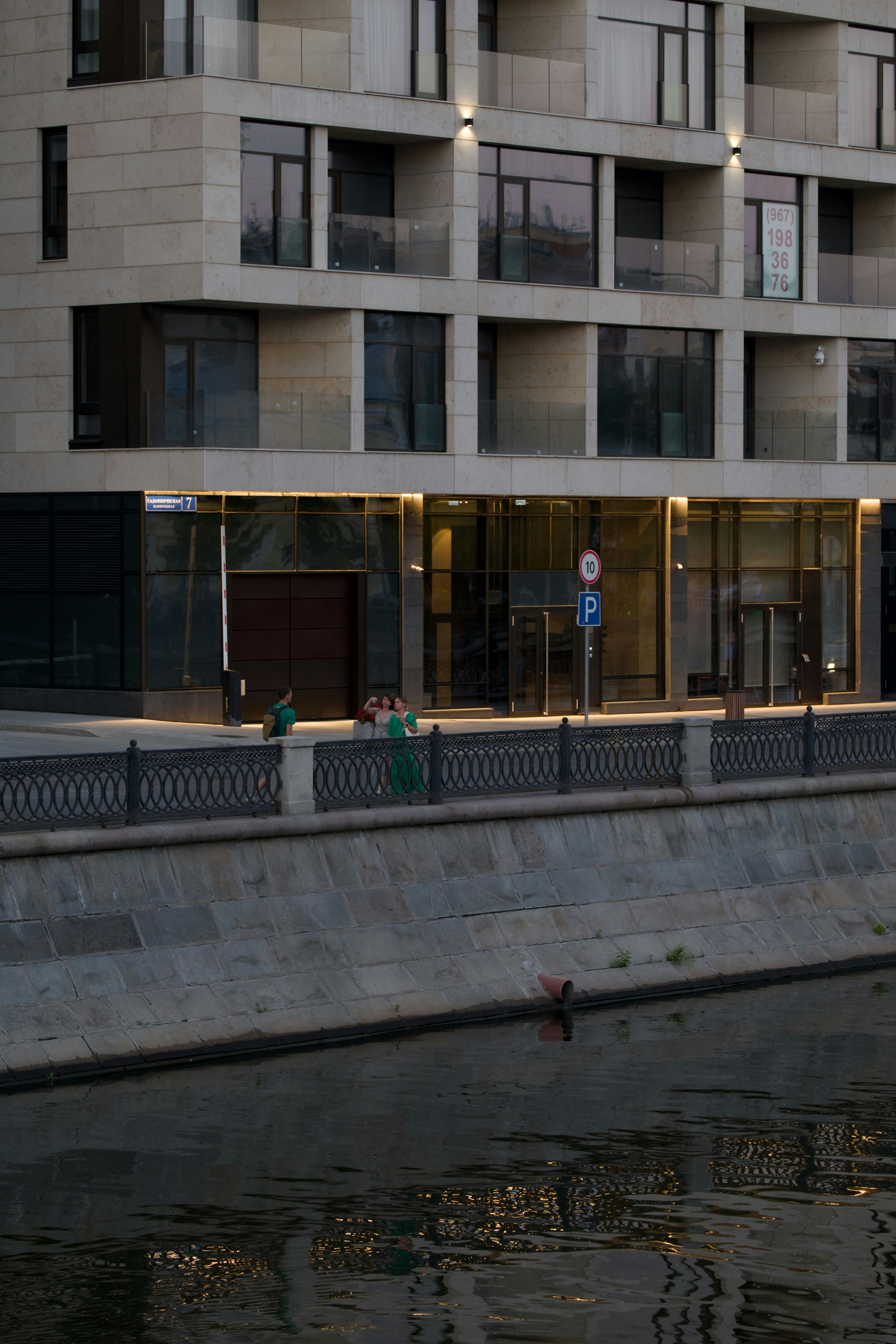 Riverside Glow: Evening Light on a Modern Facade