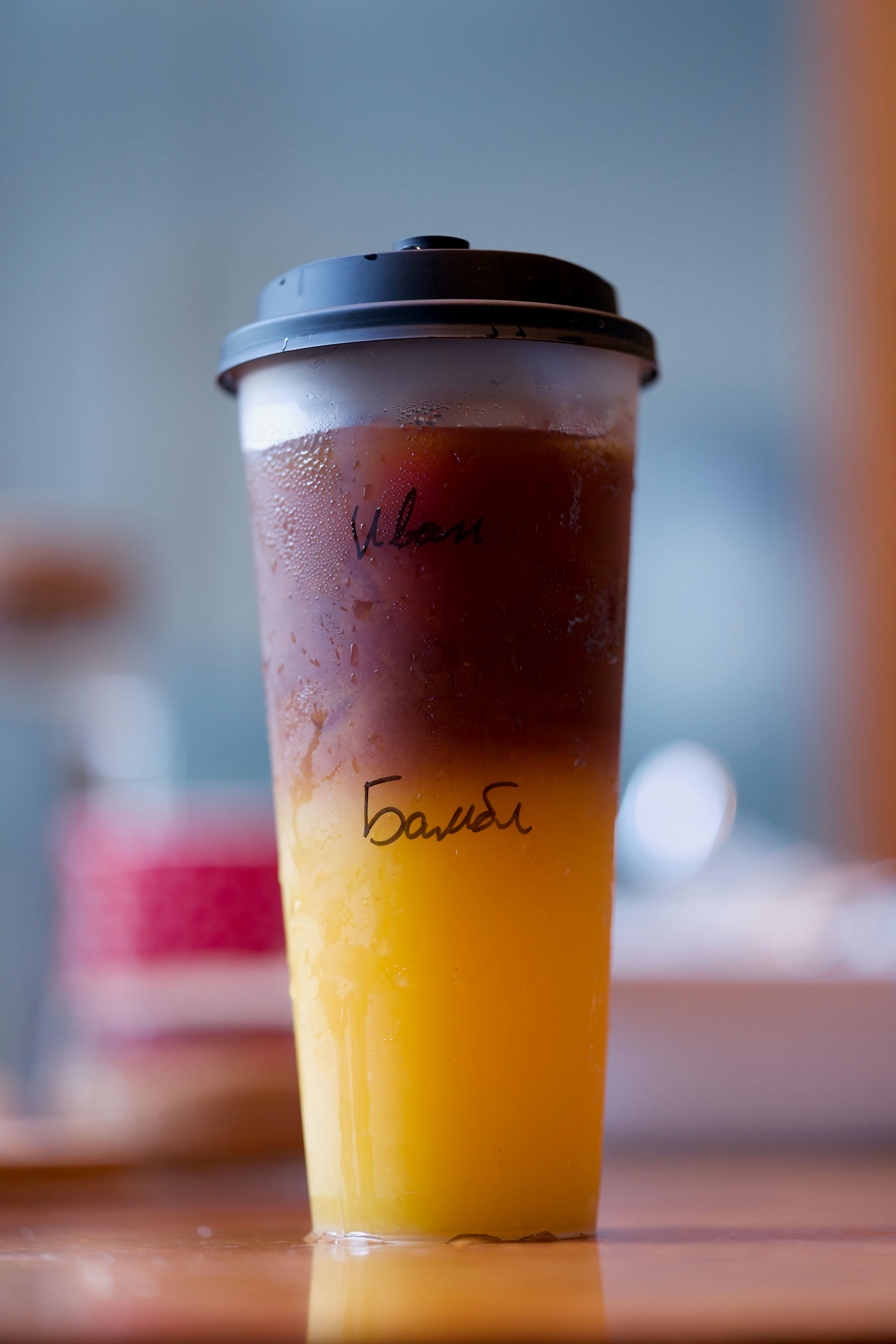 A colorful drink in a plastic cup. photo – Free Image on Unsplash