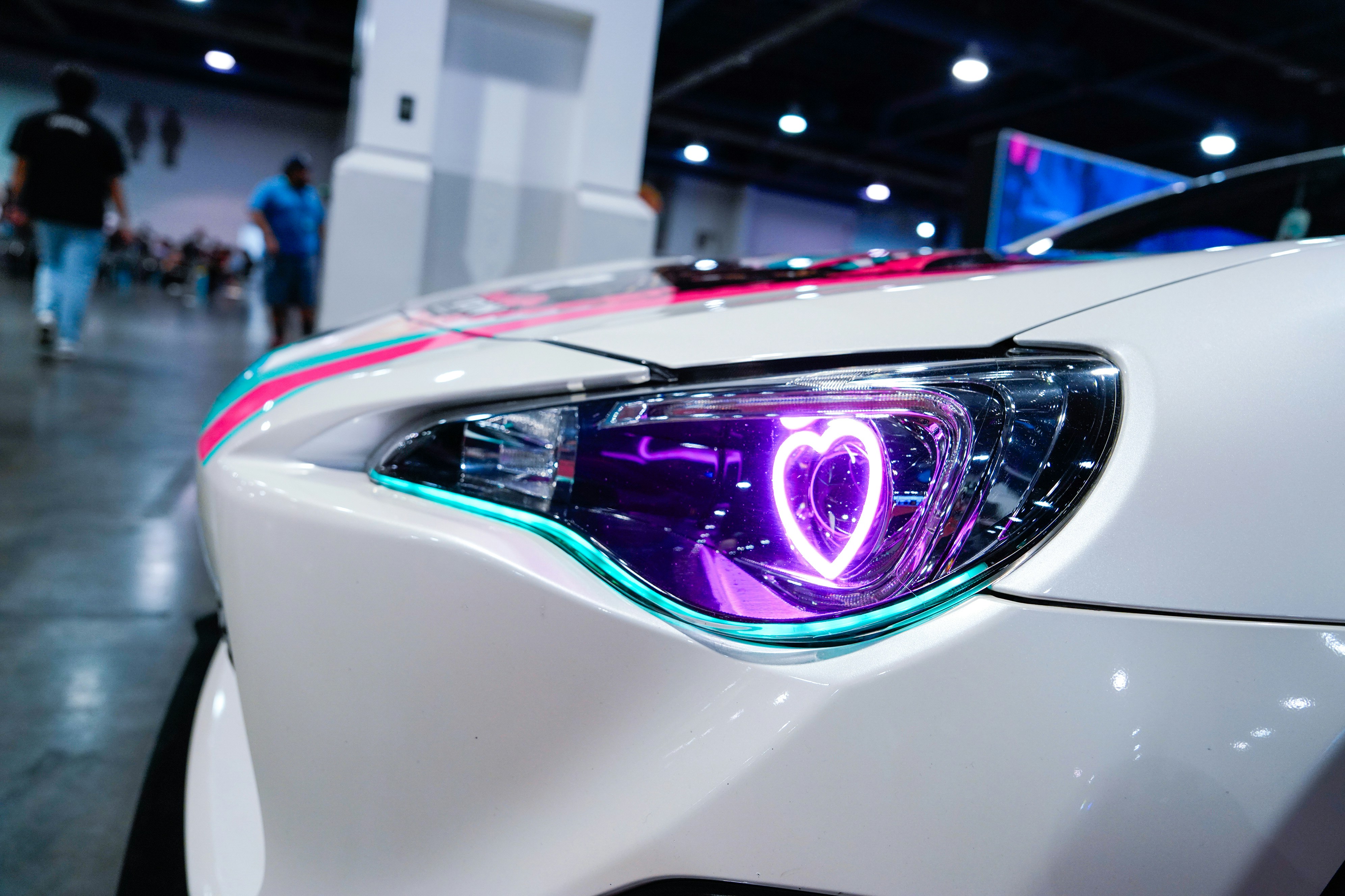 A car's headlight has a glowing heart shape. photo – Free Car Image on ...