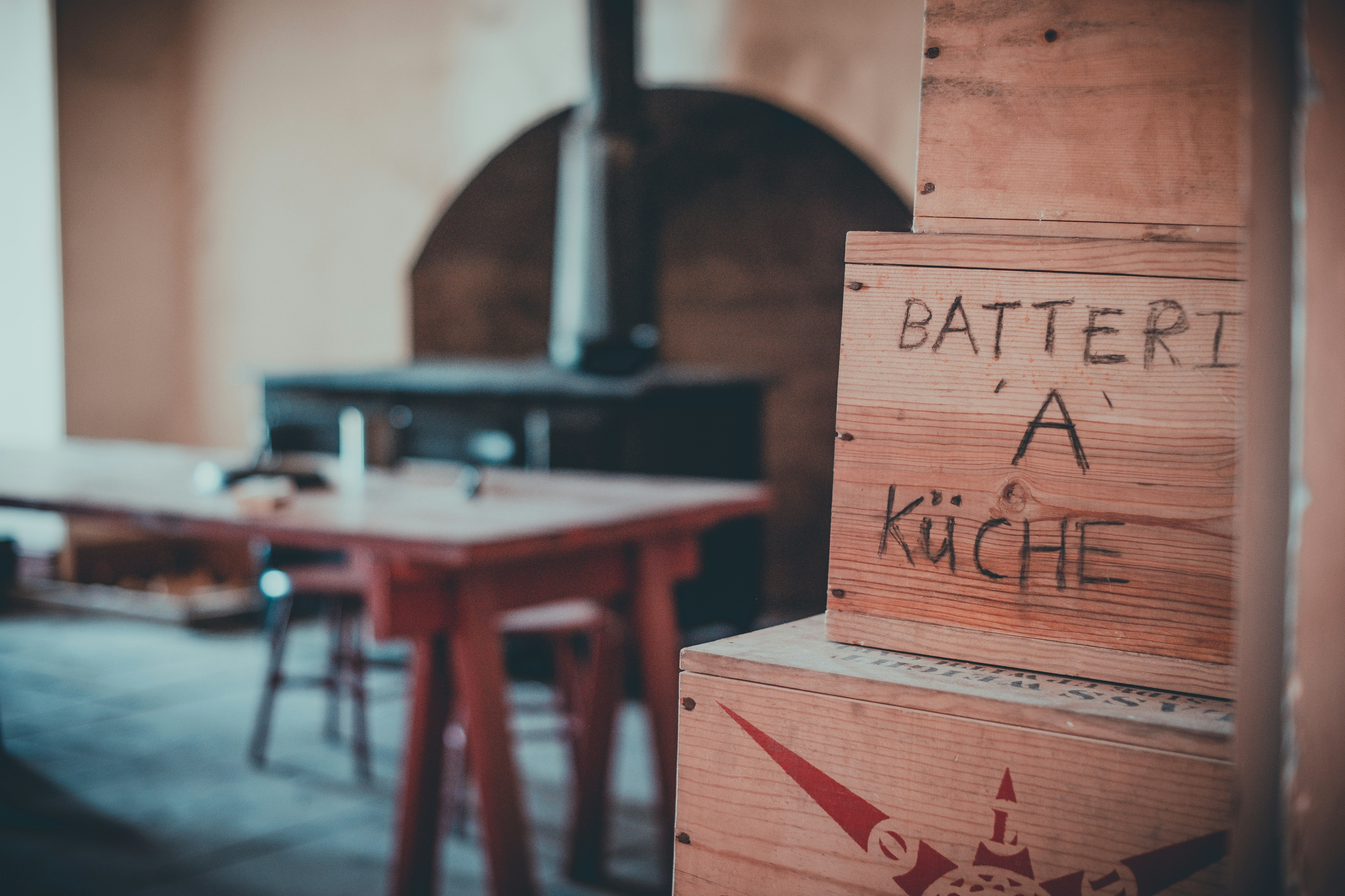 Wooden boxes and a table in a room. photo – Free Image on Unsplash